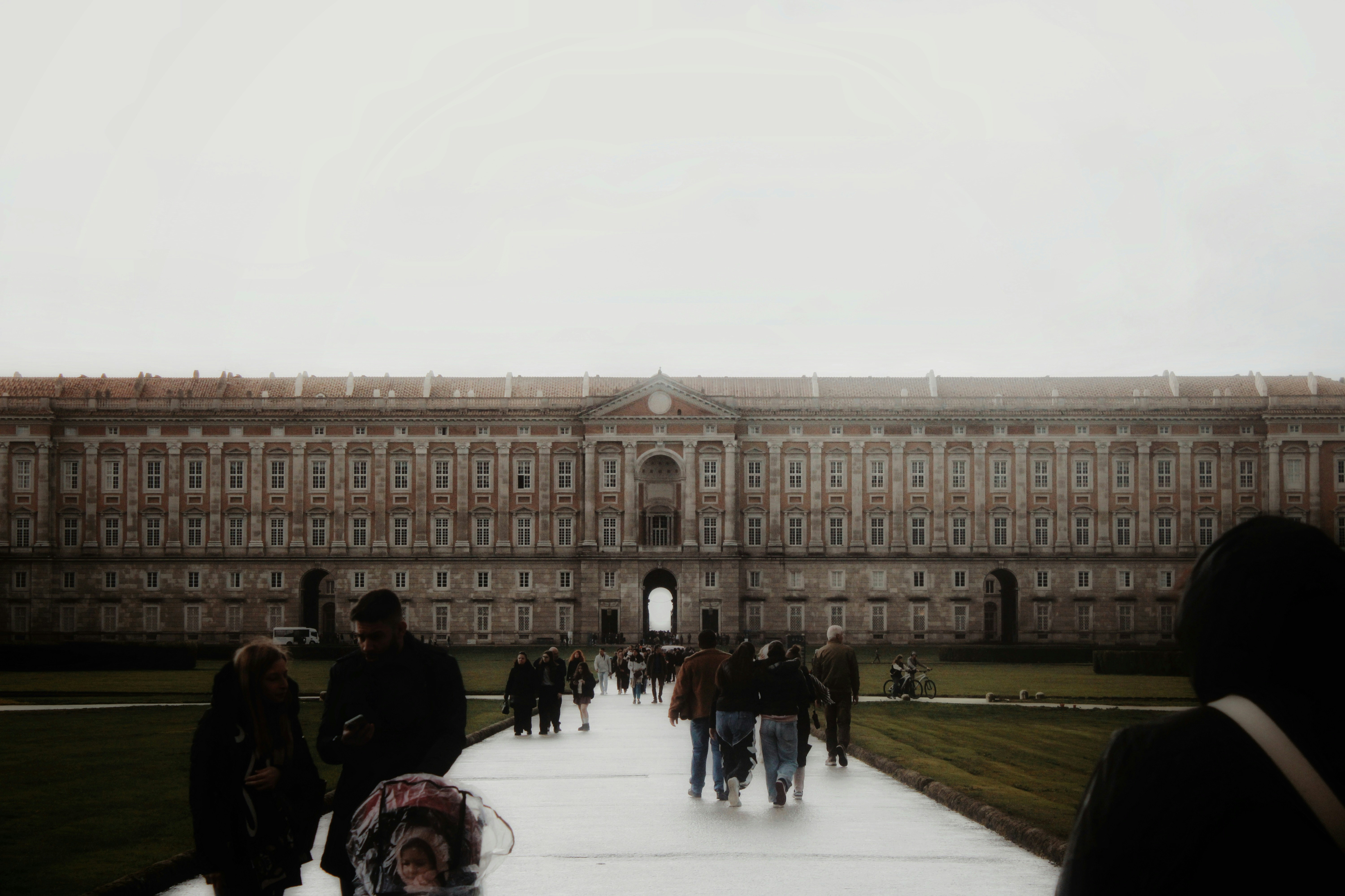 Colonnaded Gatehouse Corridor: People Crossing the Grand Esplanade