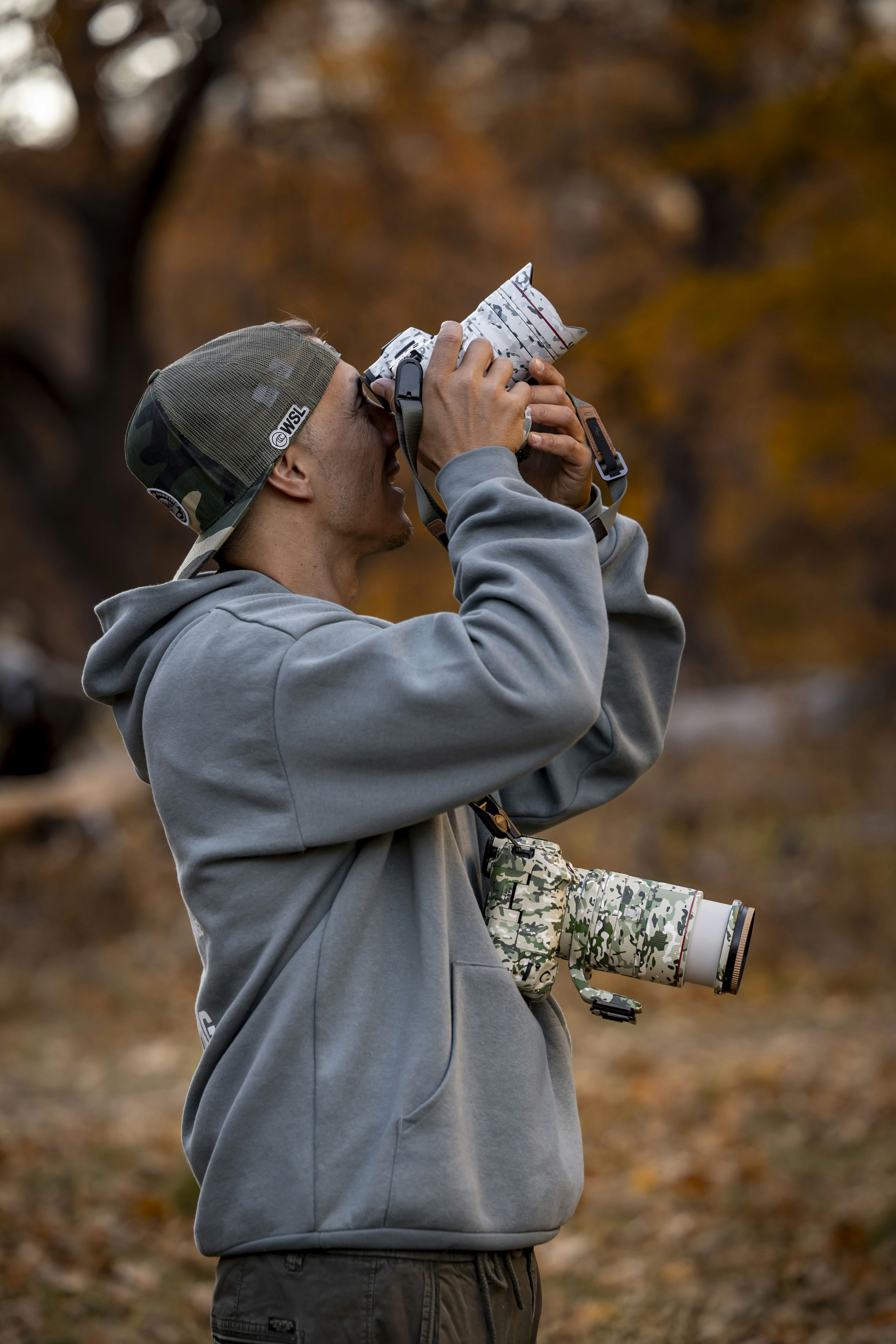 Autumn Alchemy: A Photographer Elevates a Moment with a Camouflaged Lens