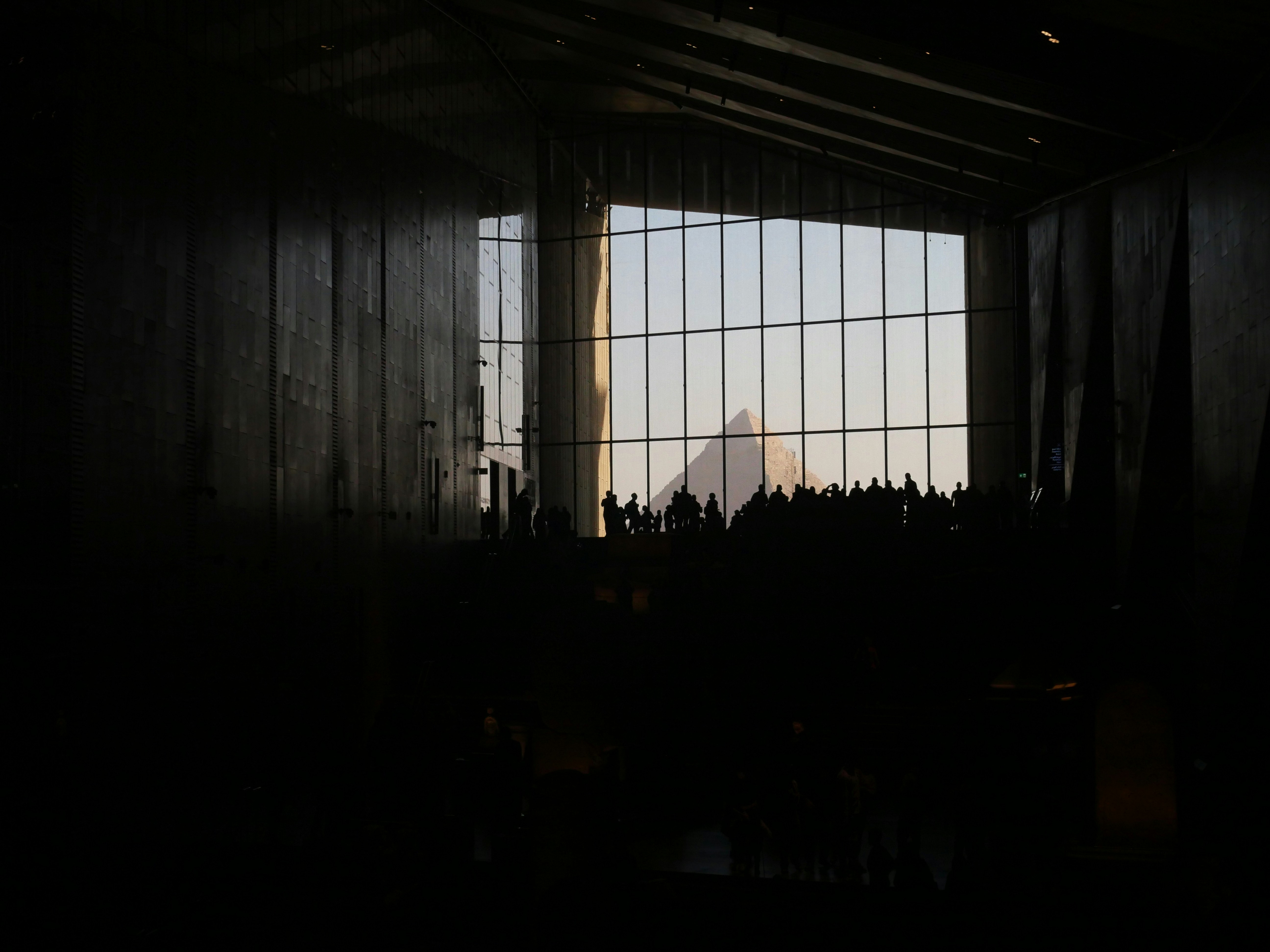 Silhouette Overlook: Mountain Peak Framed by a Darkened Hall