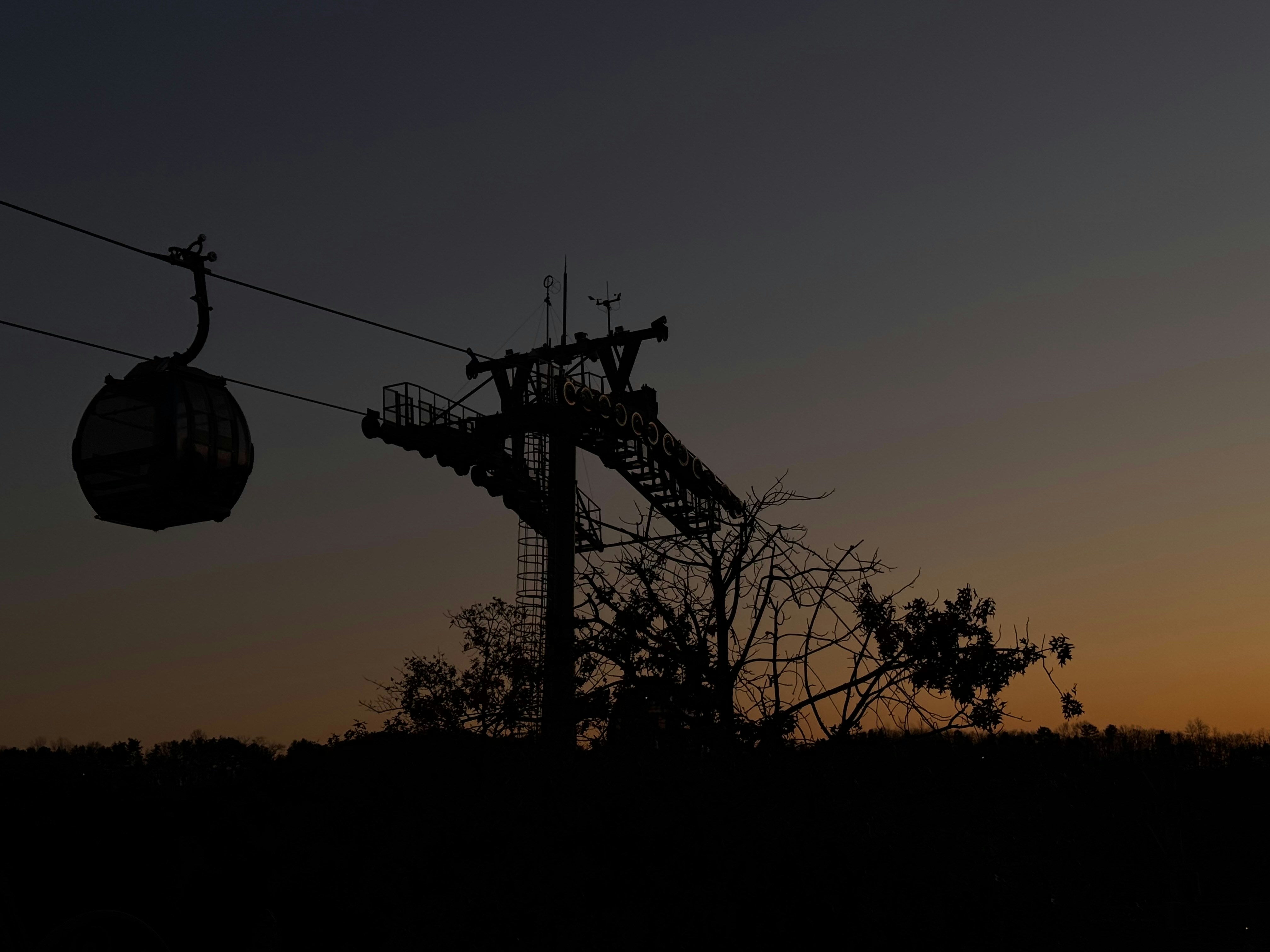 Silhouette Lift: Sunset Chairlift against a Quiet Horizon