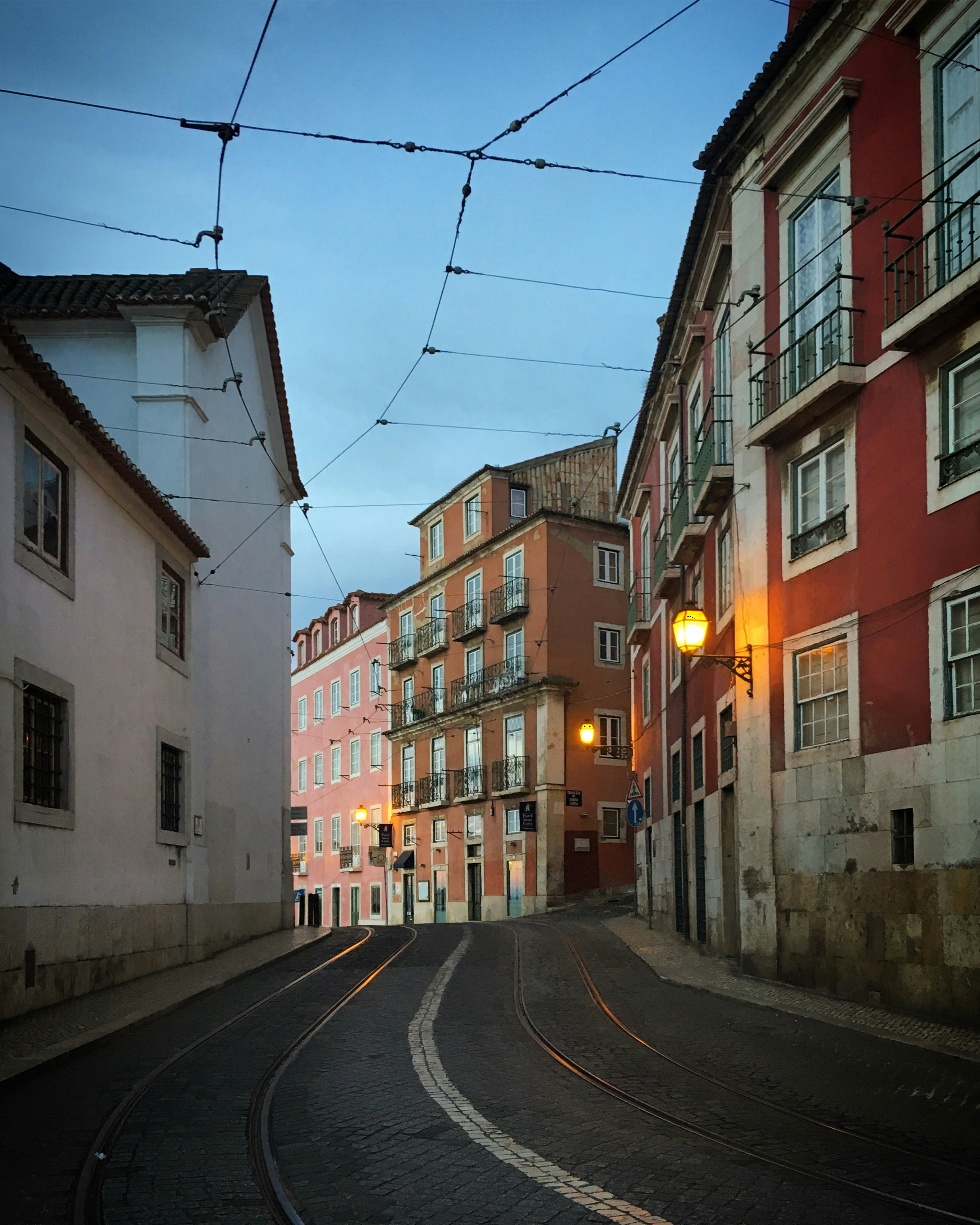 Cobbled Traces: A Quiet Tram-Threaded Street Through Lisbon-Style Alleys