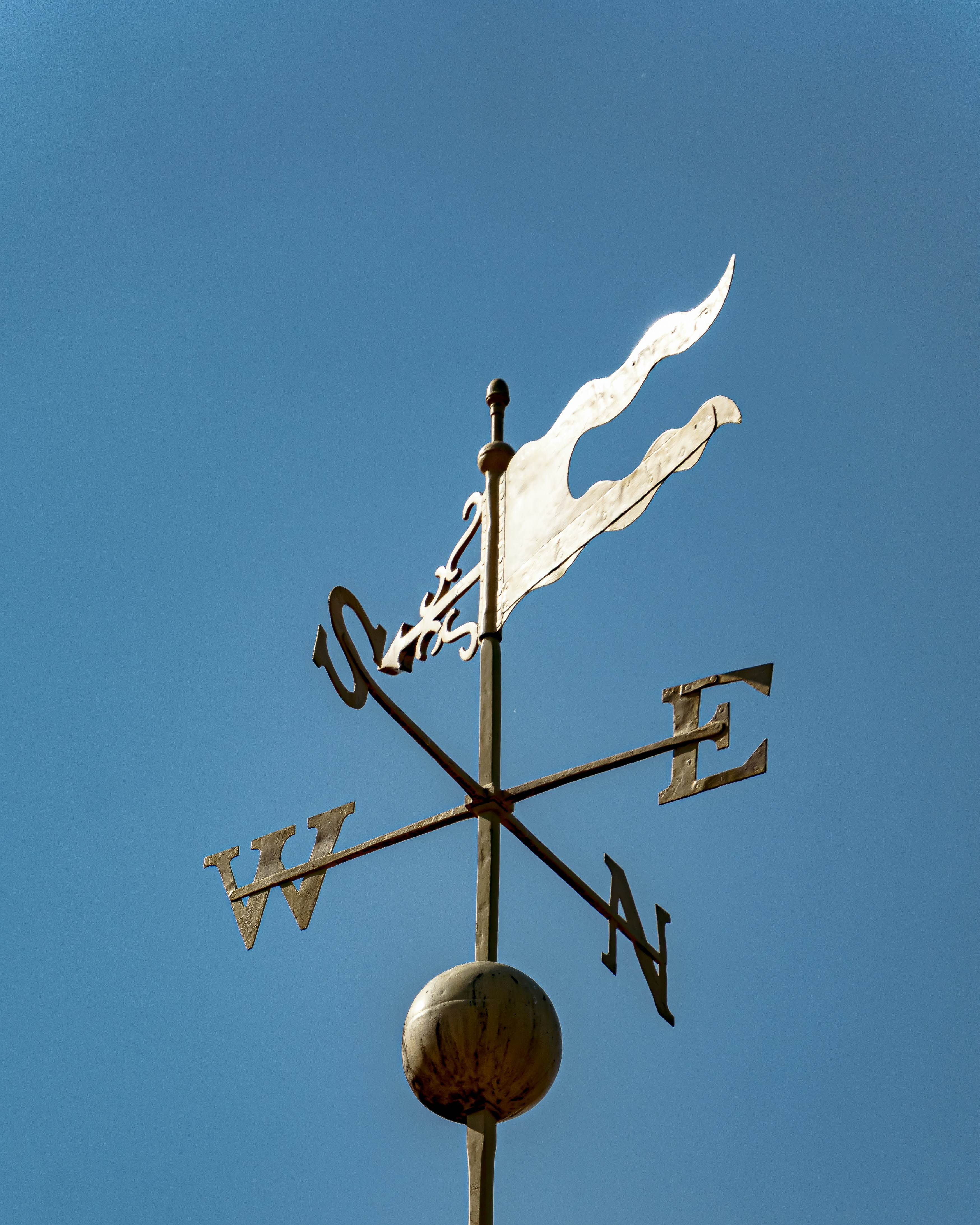 Weather Vane Crowned by a Wisp of Wind