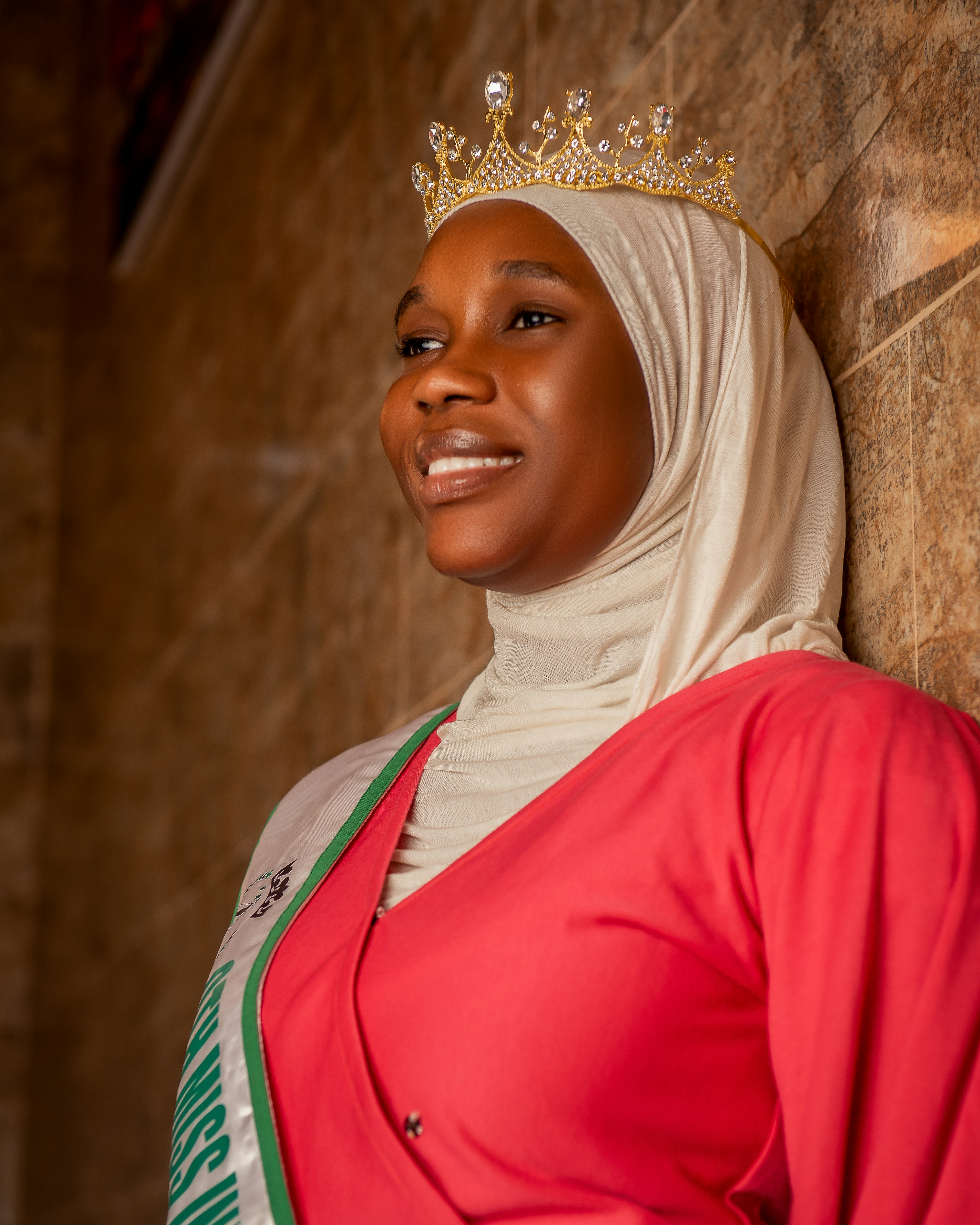 Crowned Confidence: Portrait of a Queen in Velvet Pink