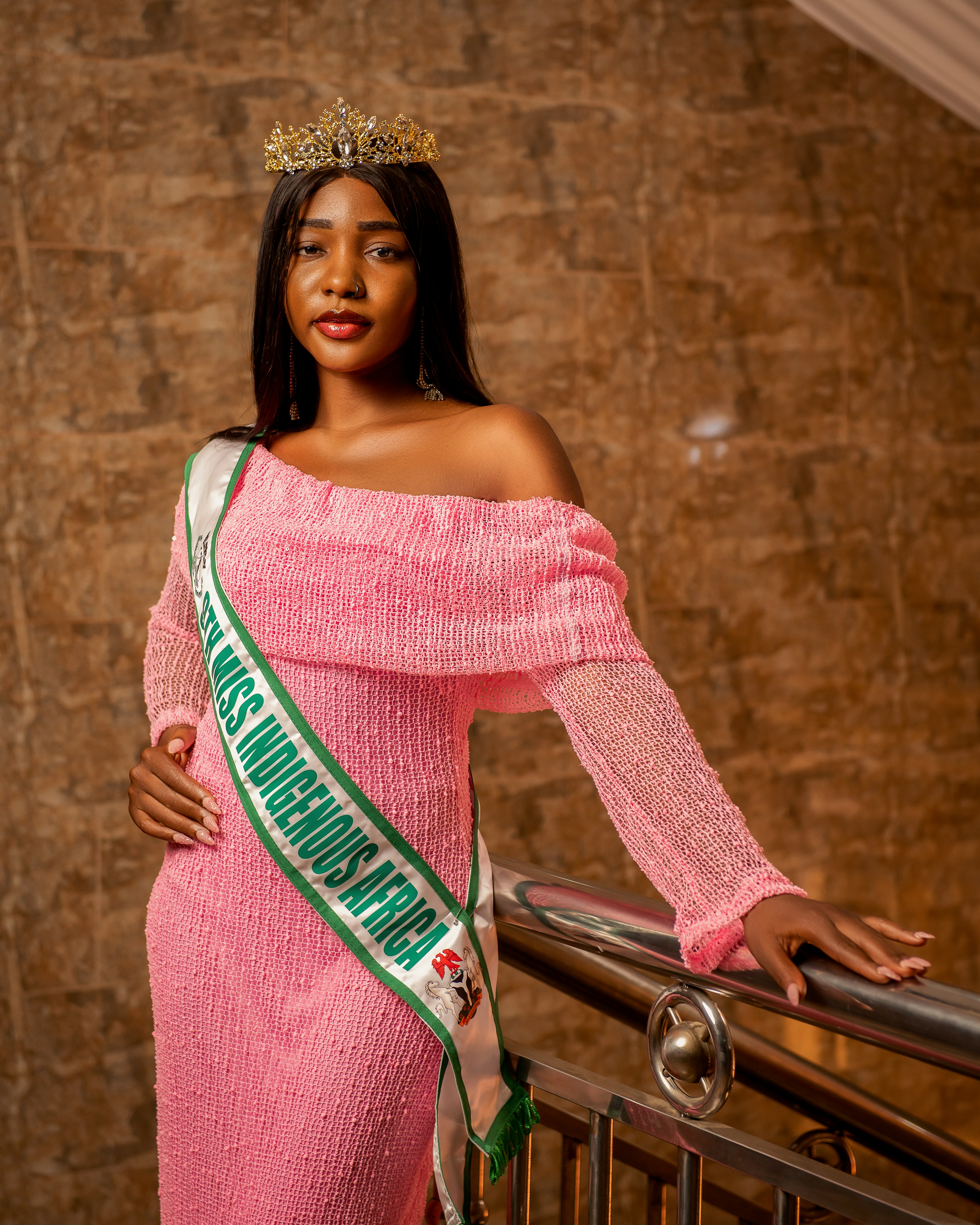 Emerald Crown: Miss Wonders Africa Stands Graceful in Pink