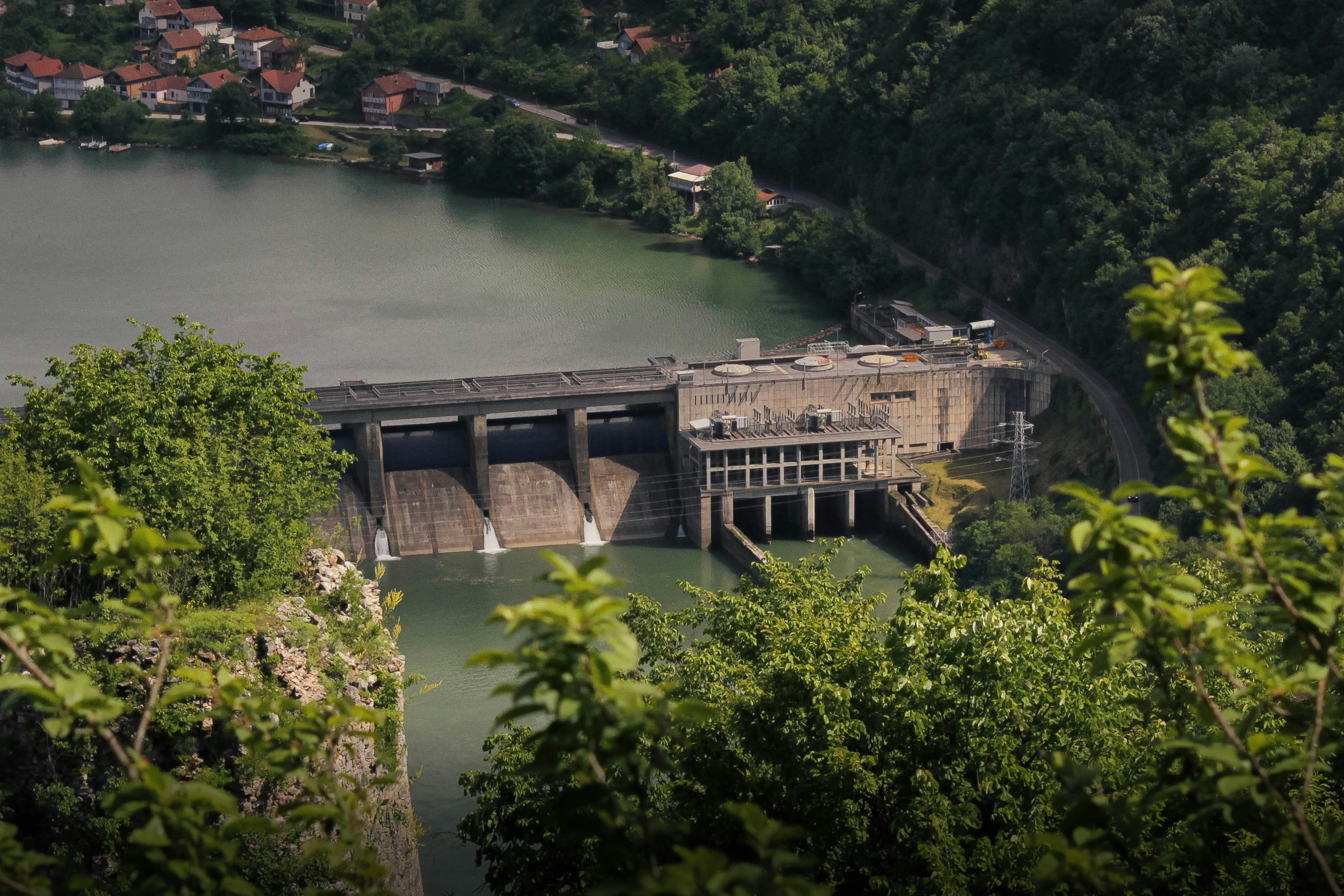 Hidden Reservoir Gate: A Quiet Dam Embraced by Green Hills