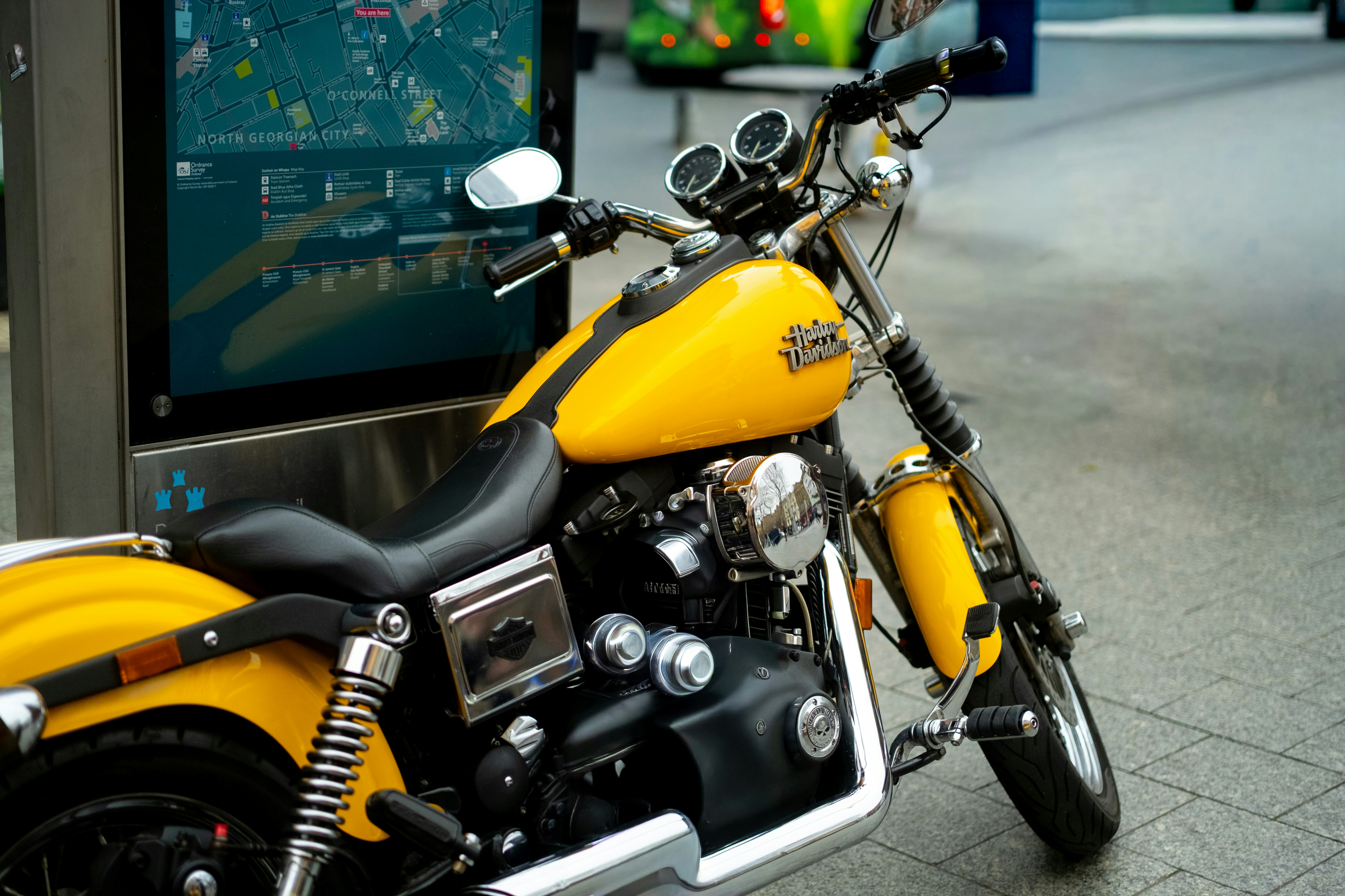 Yellow Street Cruiser: A parked Indian Scout gleams under urban lights