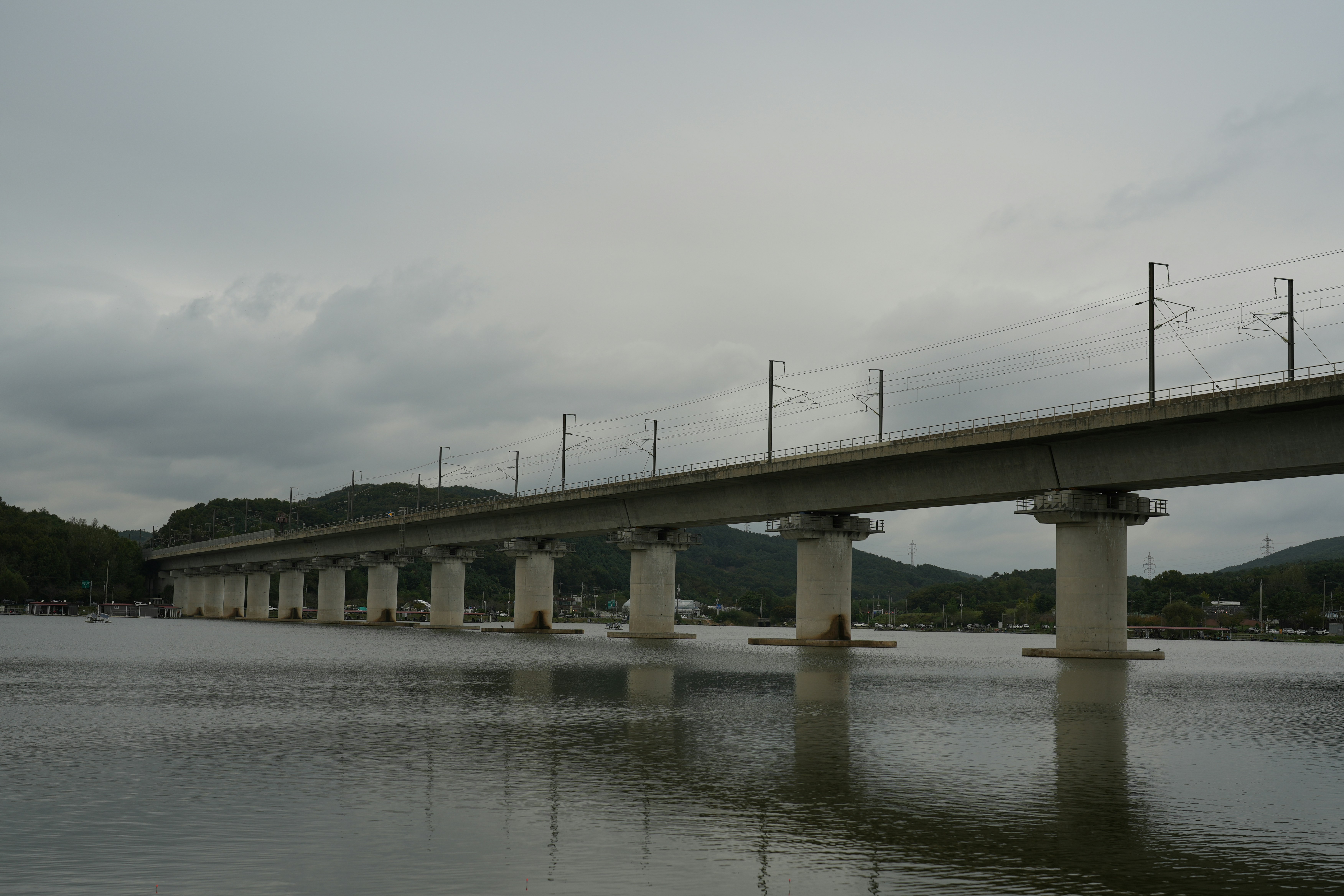 Sunlight on Quiet Waters: A Bridge Span Across the Inlet
