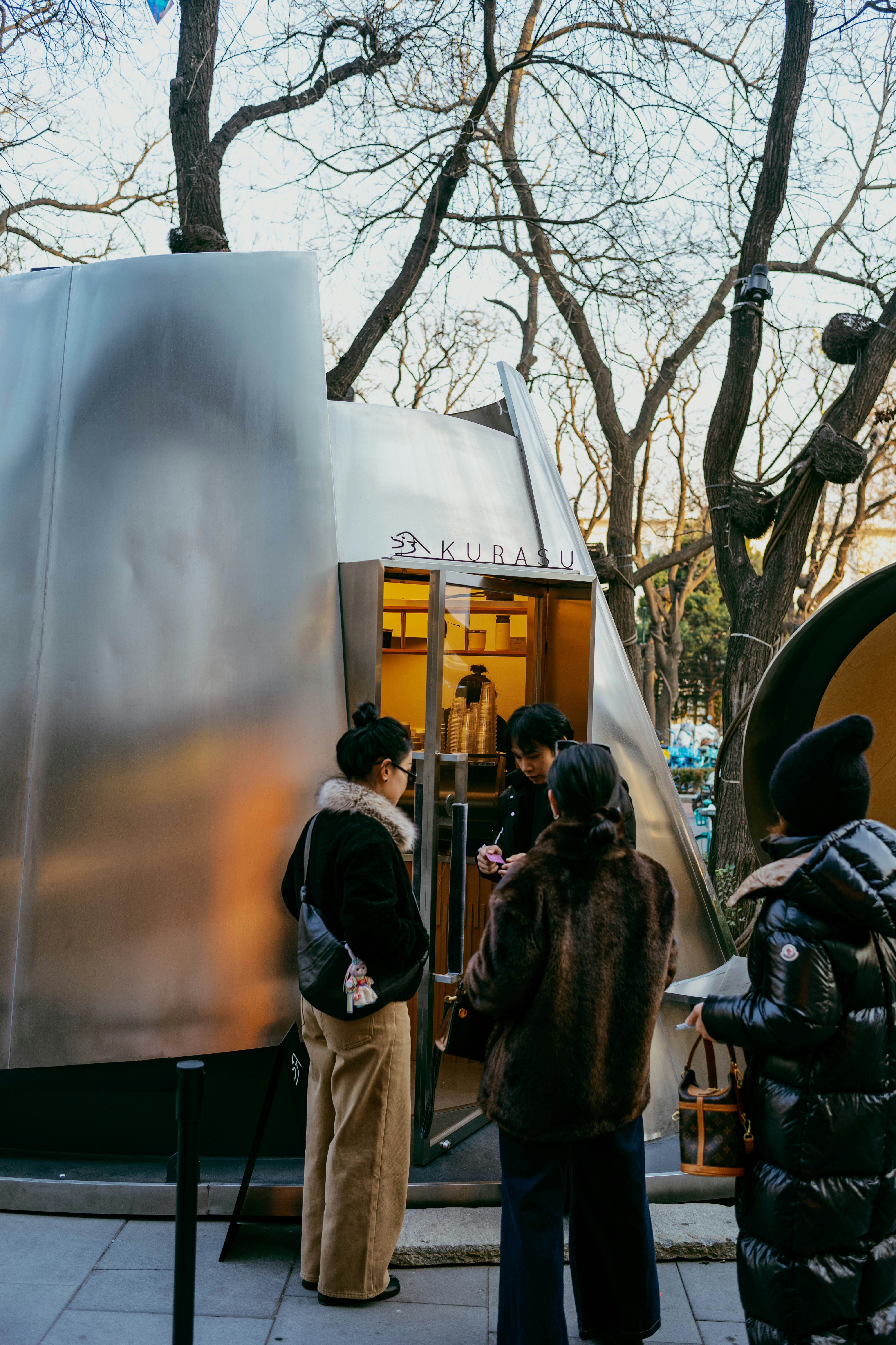Urban Teastry: People Gather at a Modern Sculpture Cafe