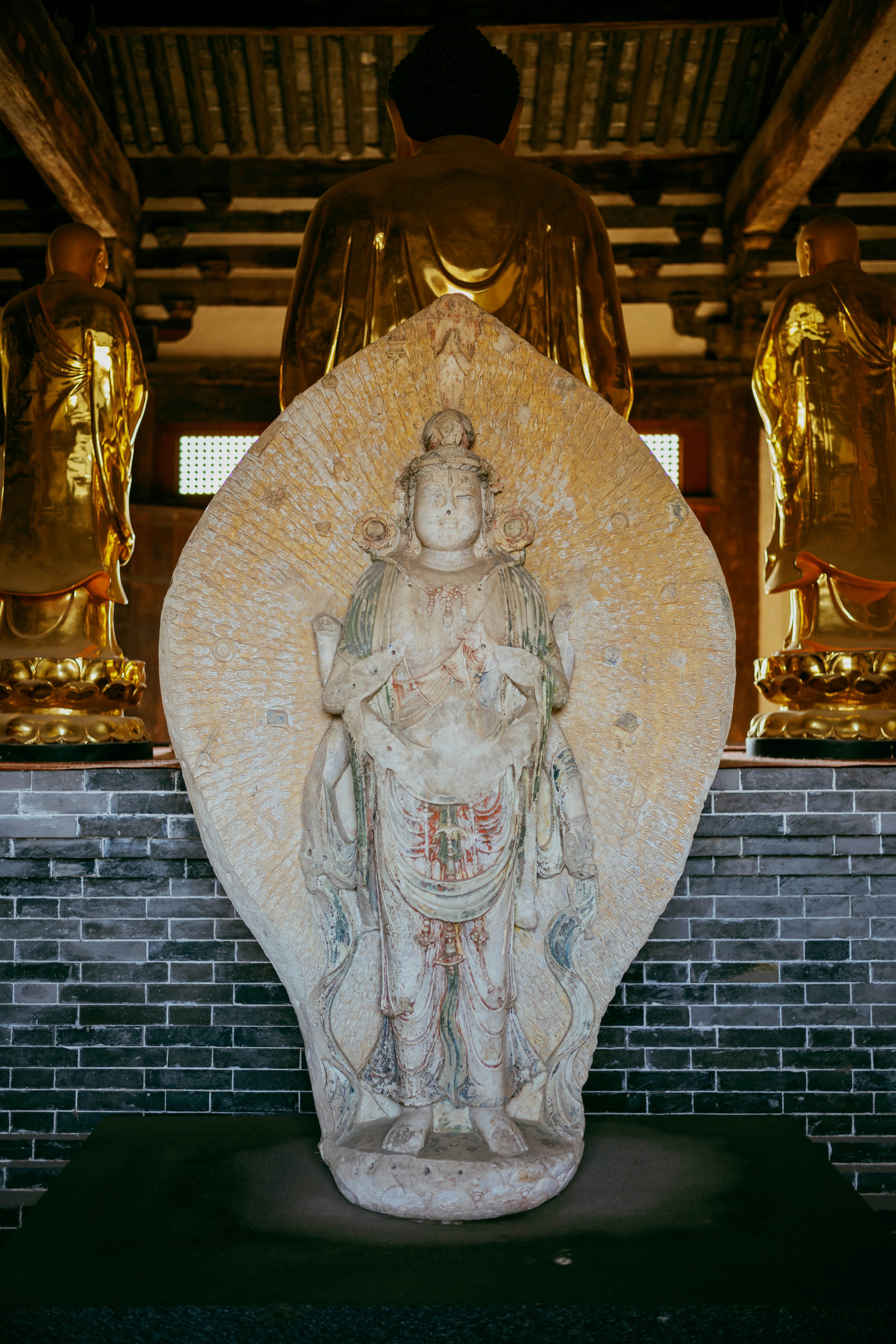 Ancient stone buddha statue with golden figures behind photo – Free ...