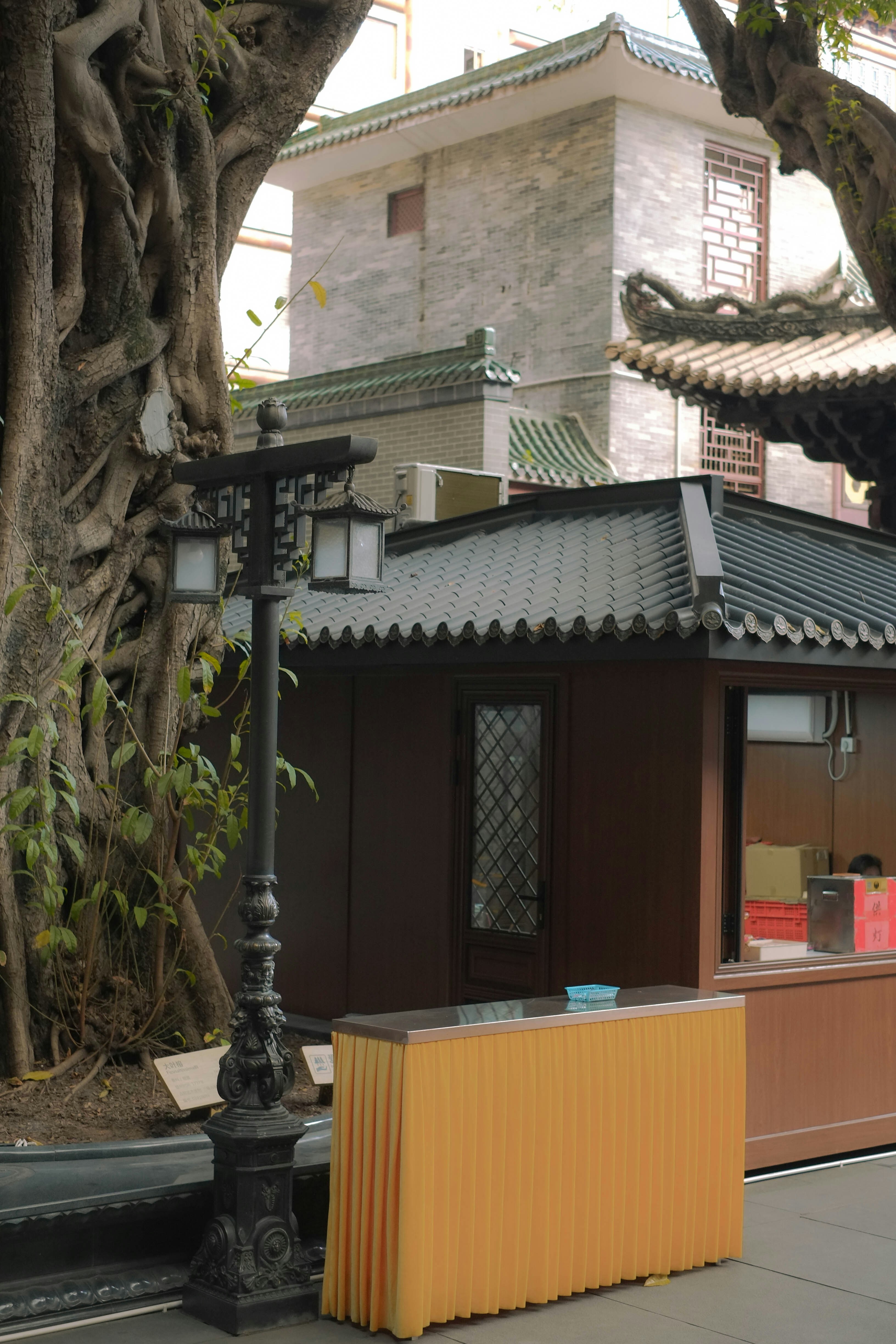 Quiet Temple Courtyard with Ribbed Roof and Lantern