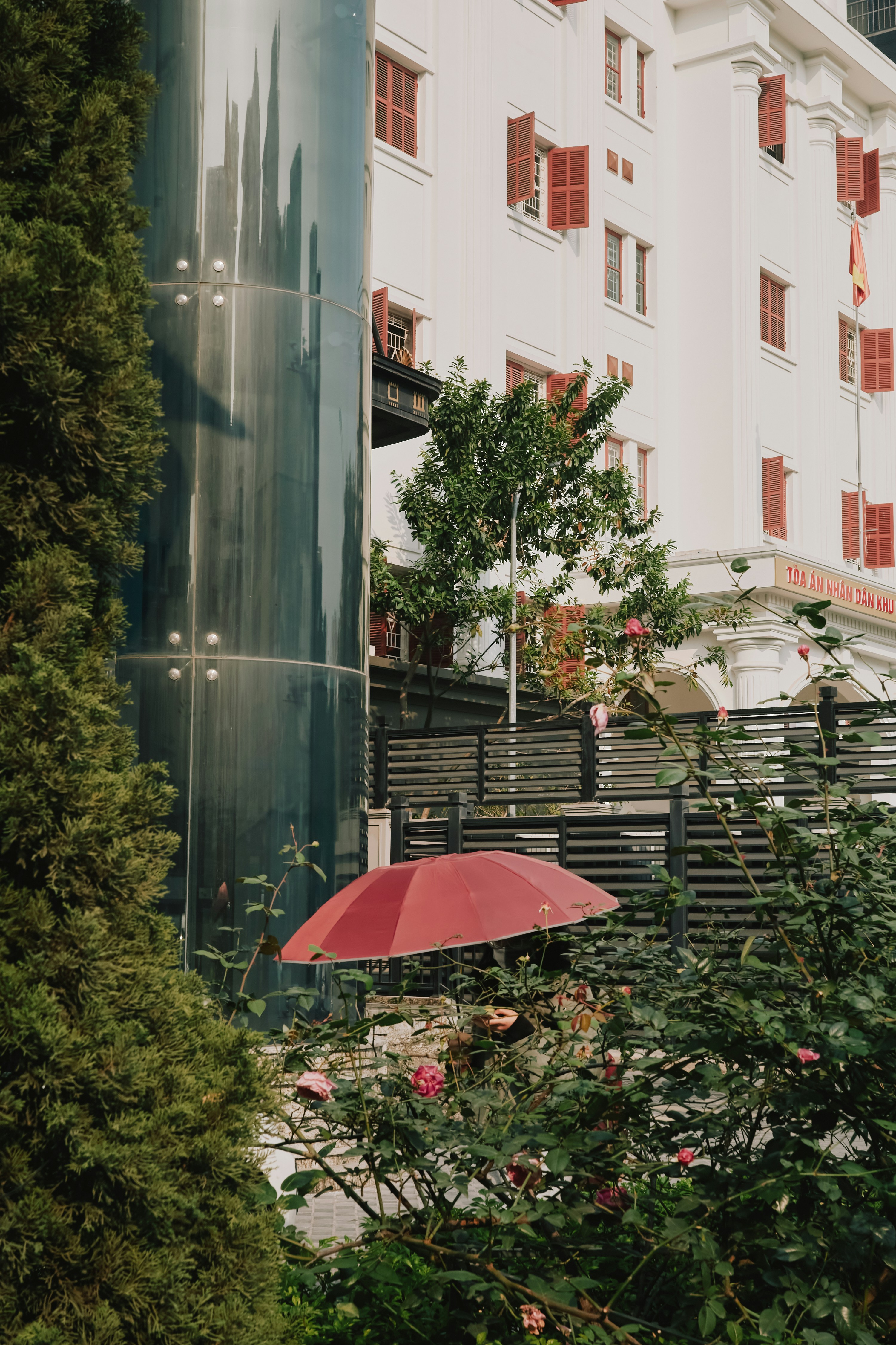 Red Umbrella Beneath a Charleston-esque Facade
