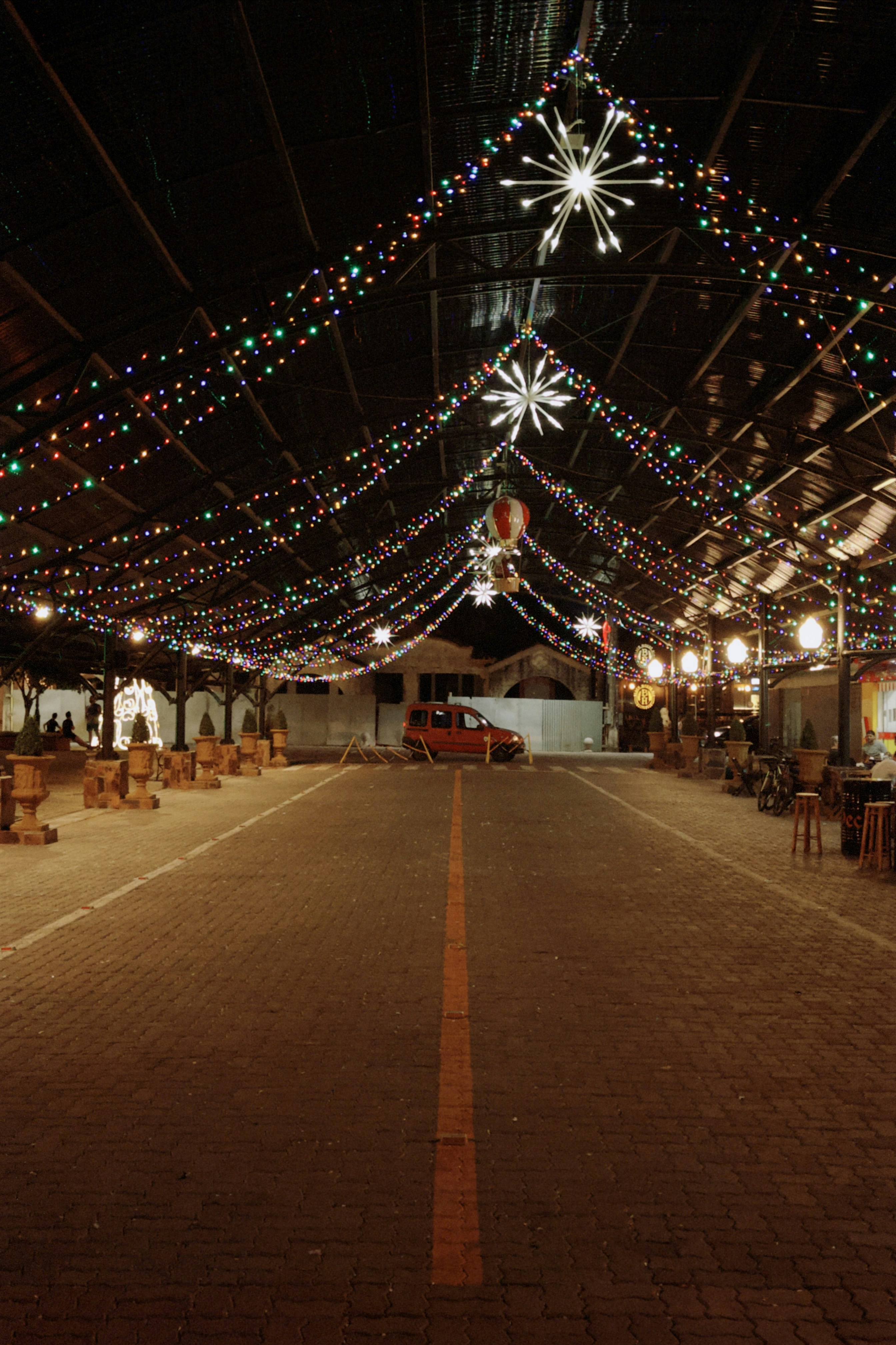 Festive Market Aisle Under Edgelit Sky