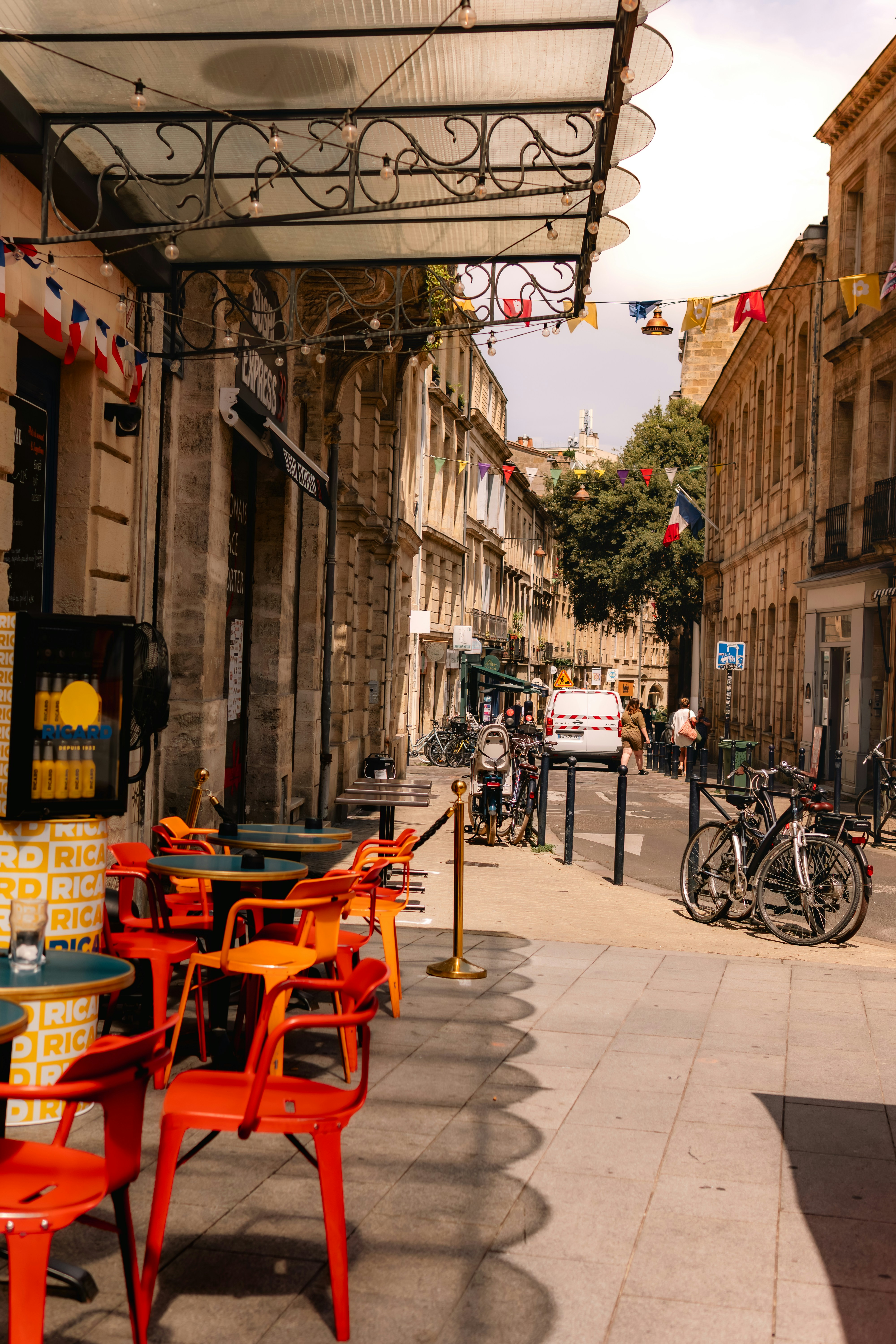 Café Terrace on a Sunlit European Street