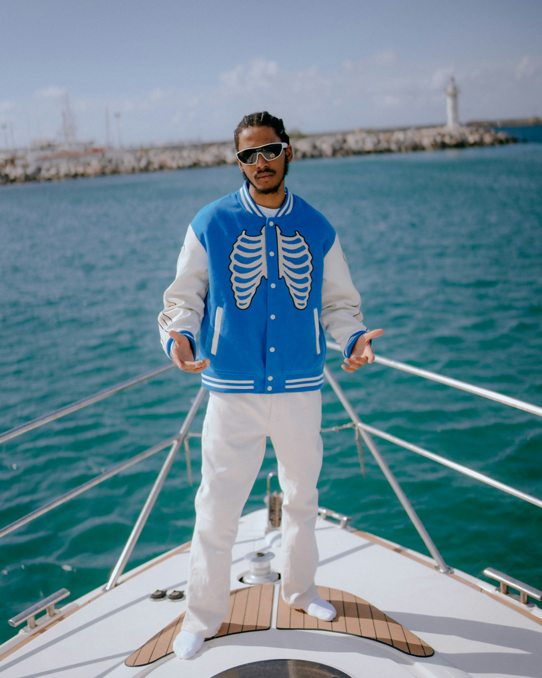 Stance at Sea: Neon Jacket on the Bow