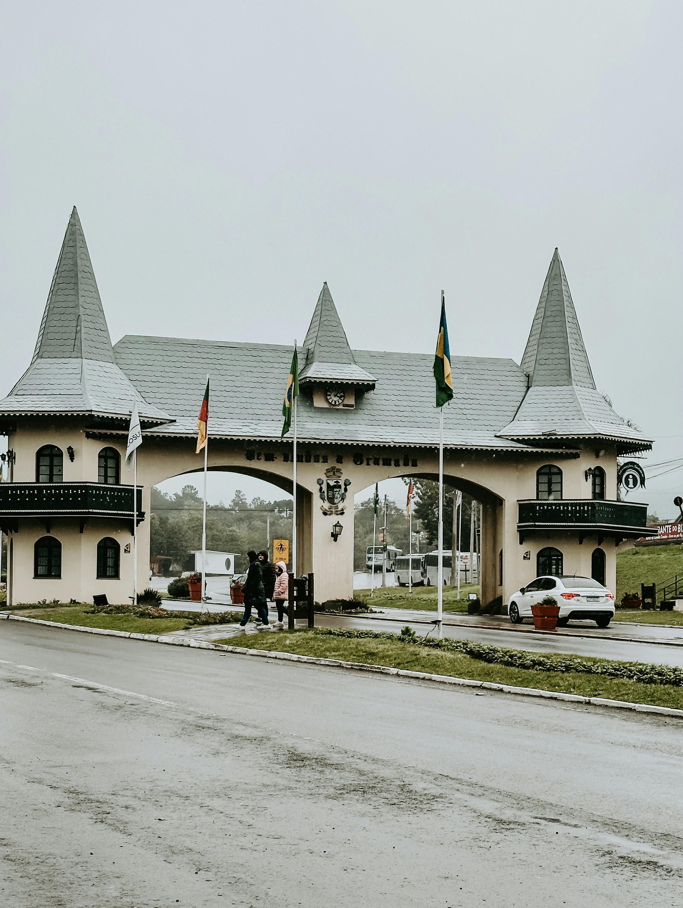 Gateway to the Park: A European-styled Archway with Flagpoles