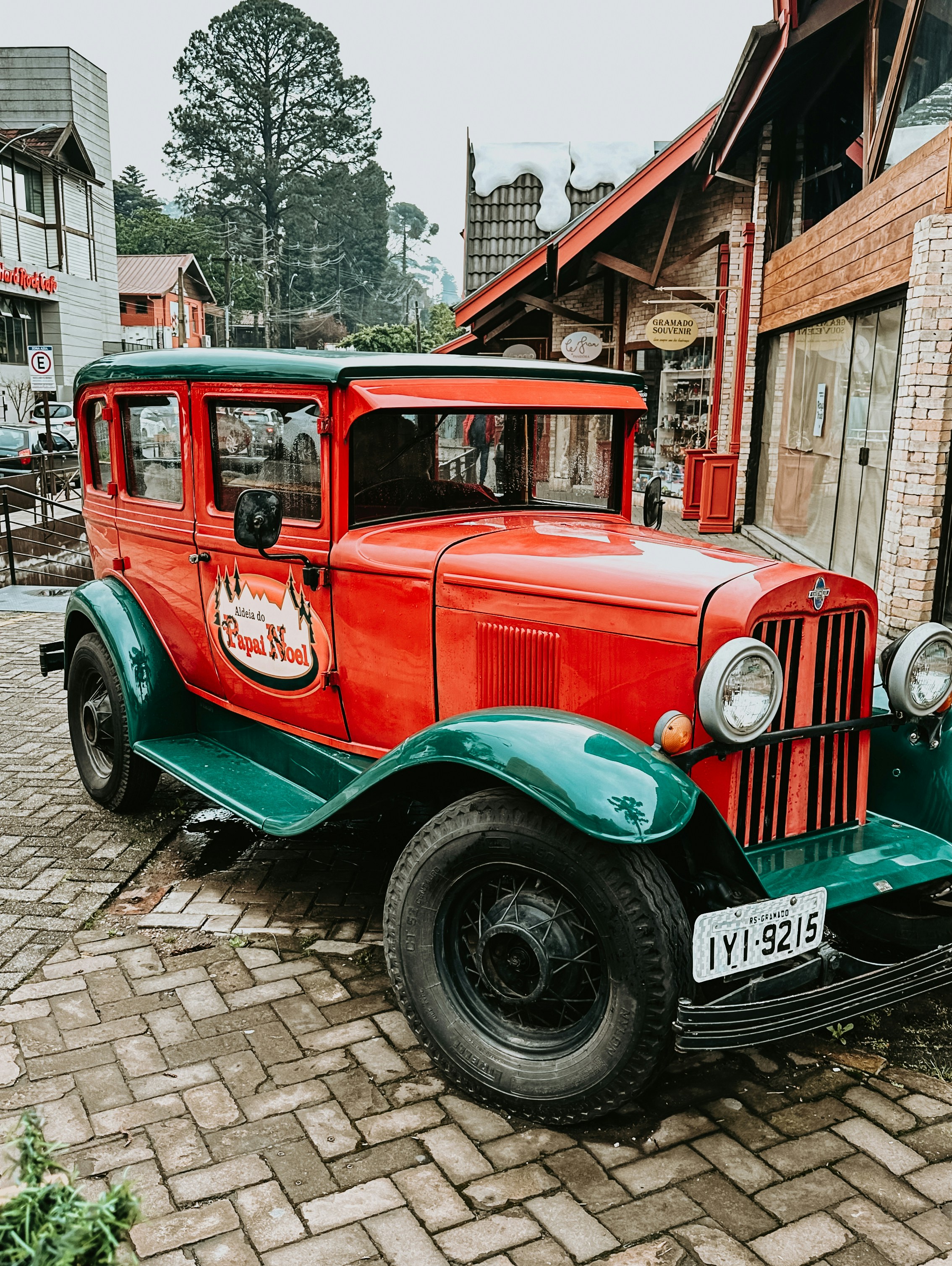 Vintage Red Tour Car in a cobbled street
