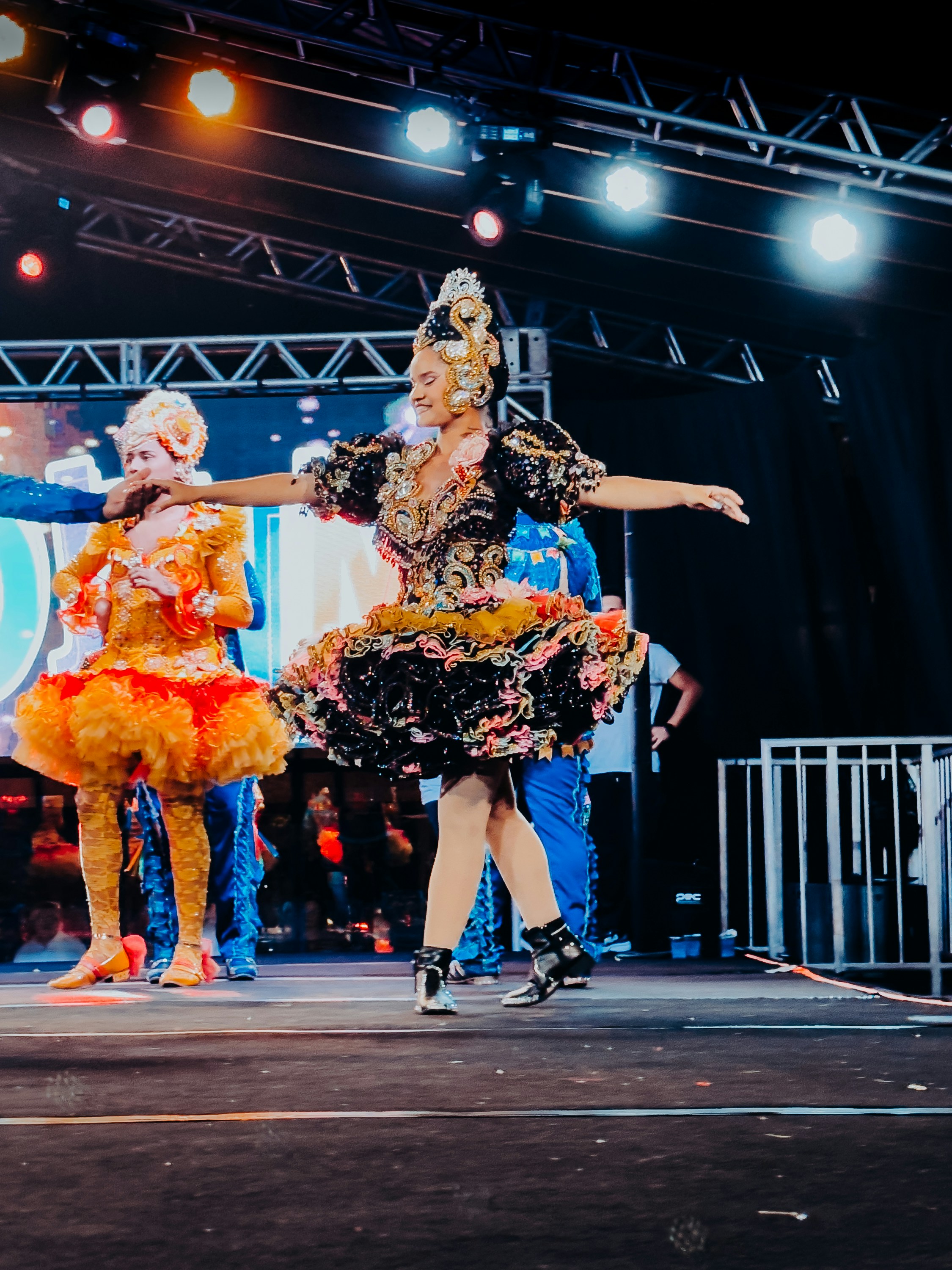 Spinning Delights: A Traditional Dance on a Neon-Highlight Stage