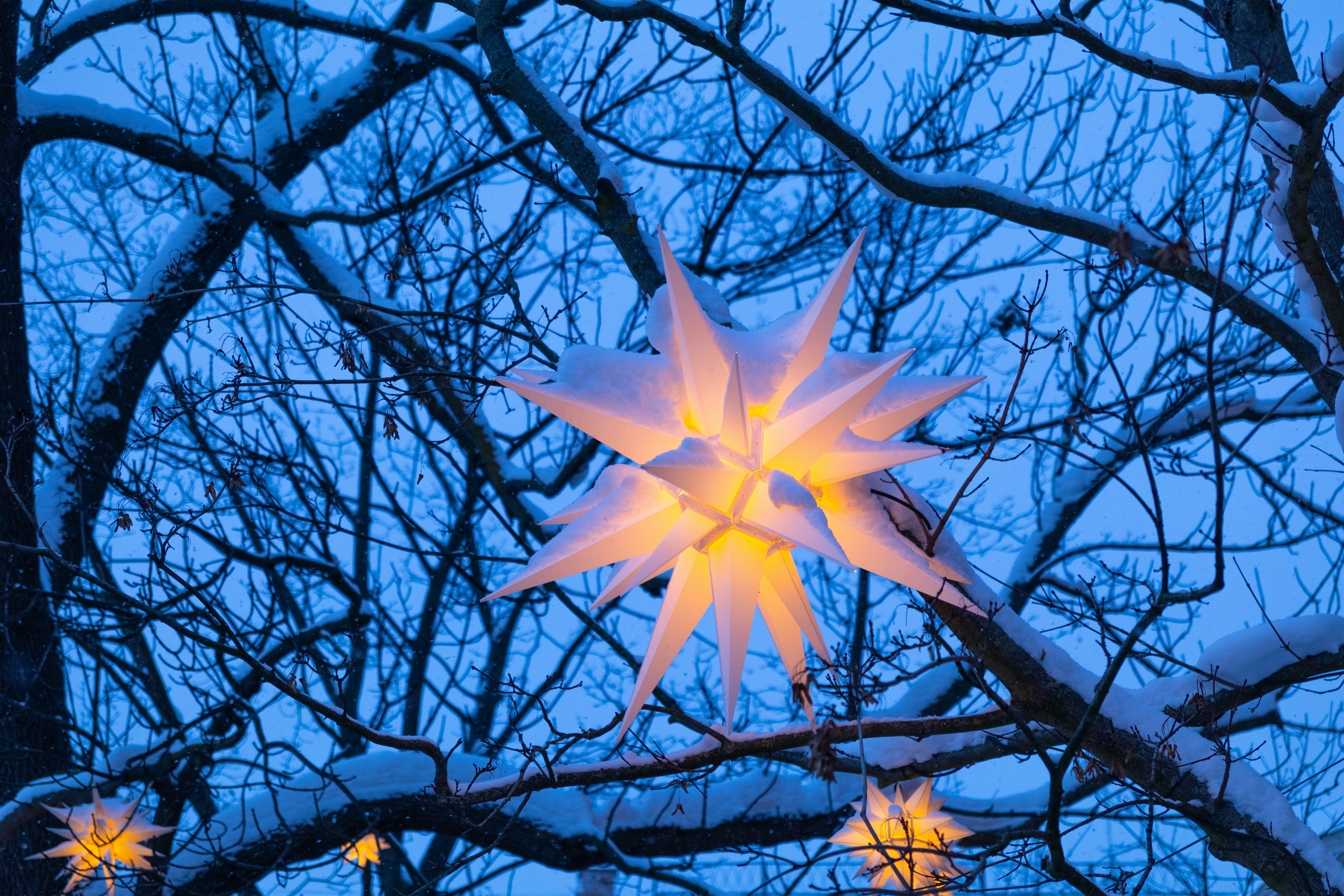 Blue Night Sky Lanterns: An Architecture of Light in Winter