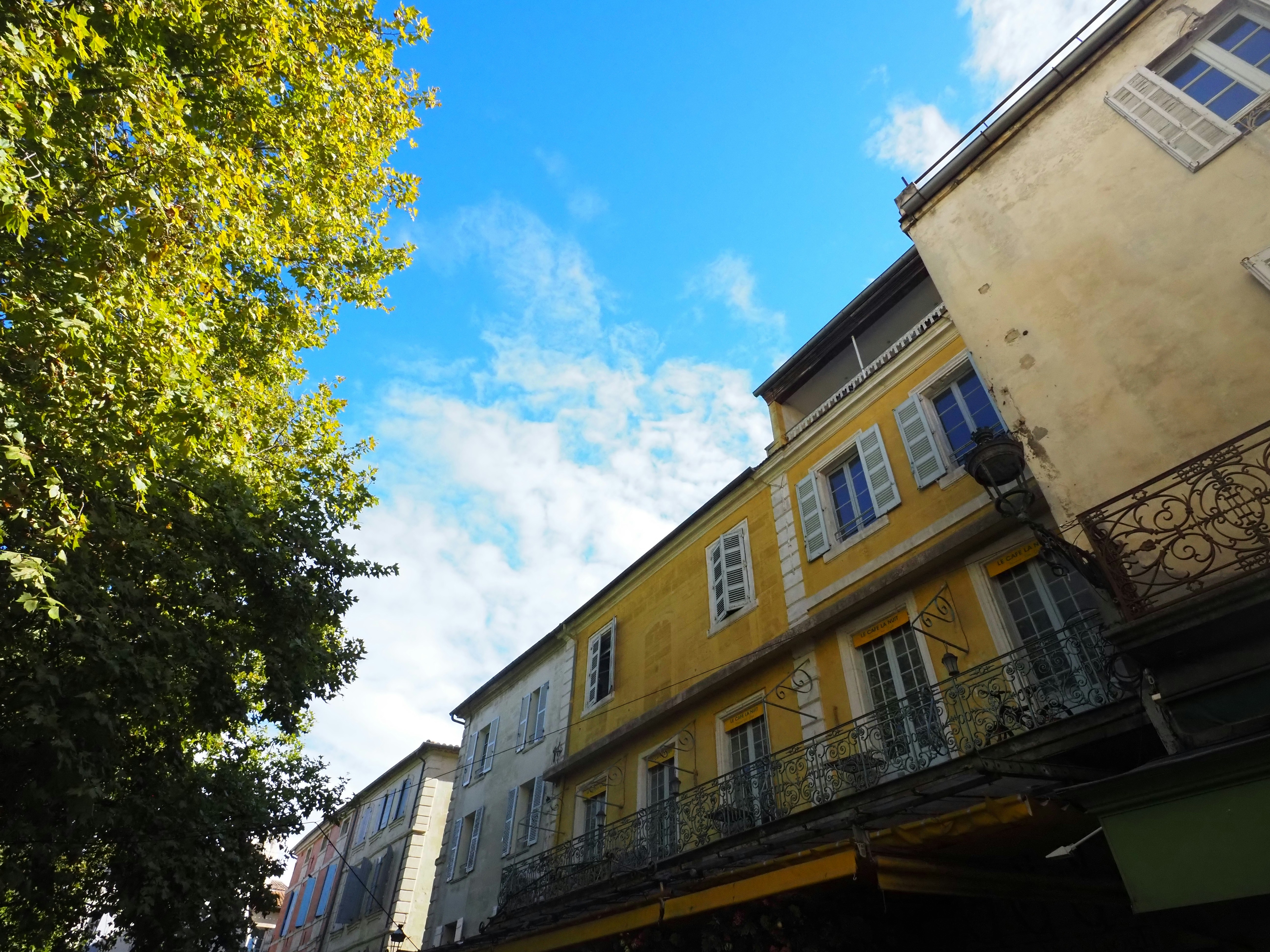 Sunlit Yellow Facade under a Bright Sky