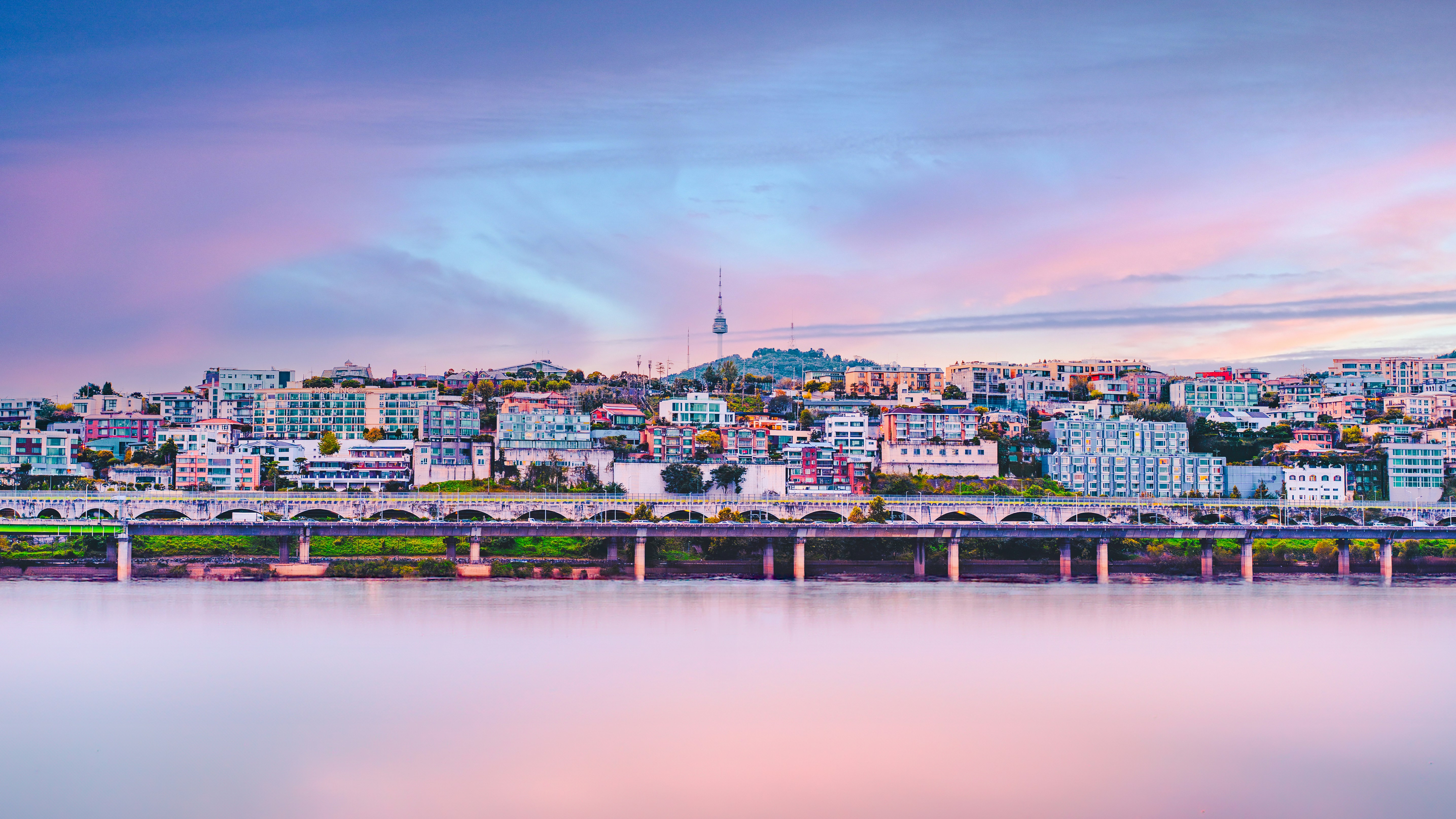 Pastel City by the River: A Quiet Evening over a Hilltop Town