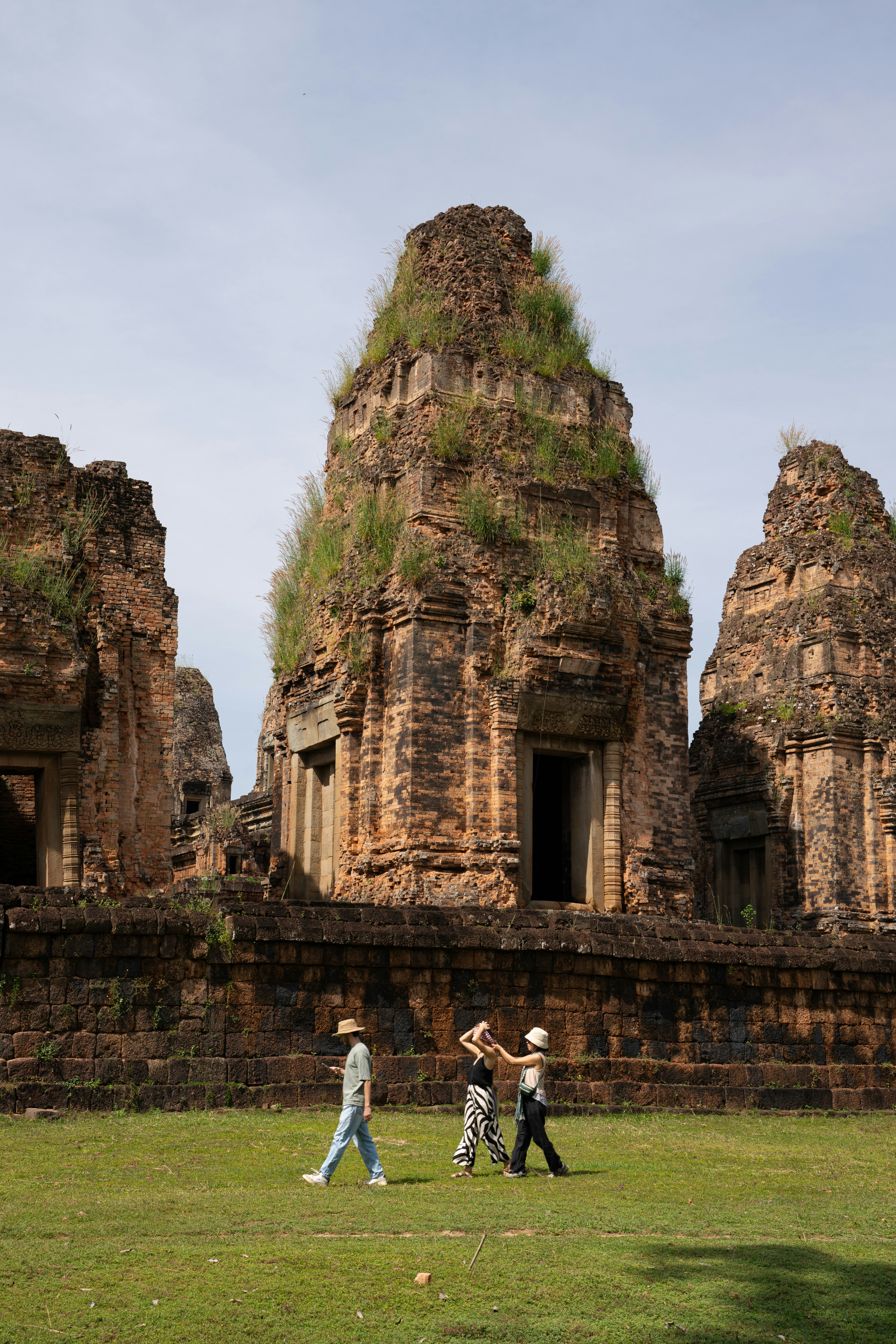 Ruinous Towers of Angkor: Sunlit Giants Surveill the Grass