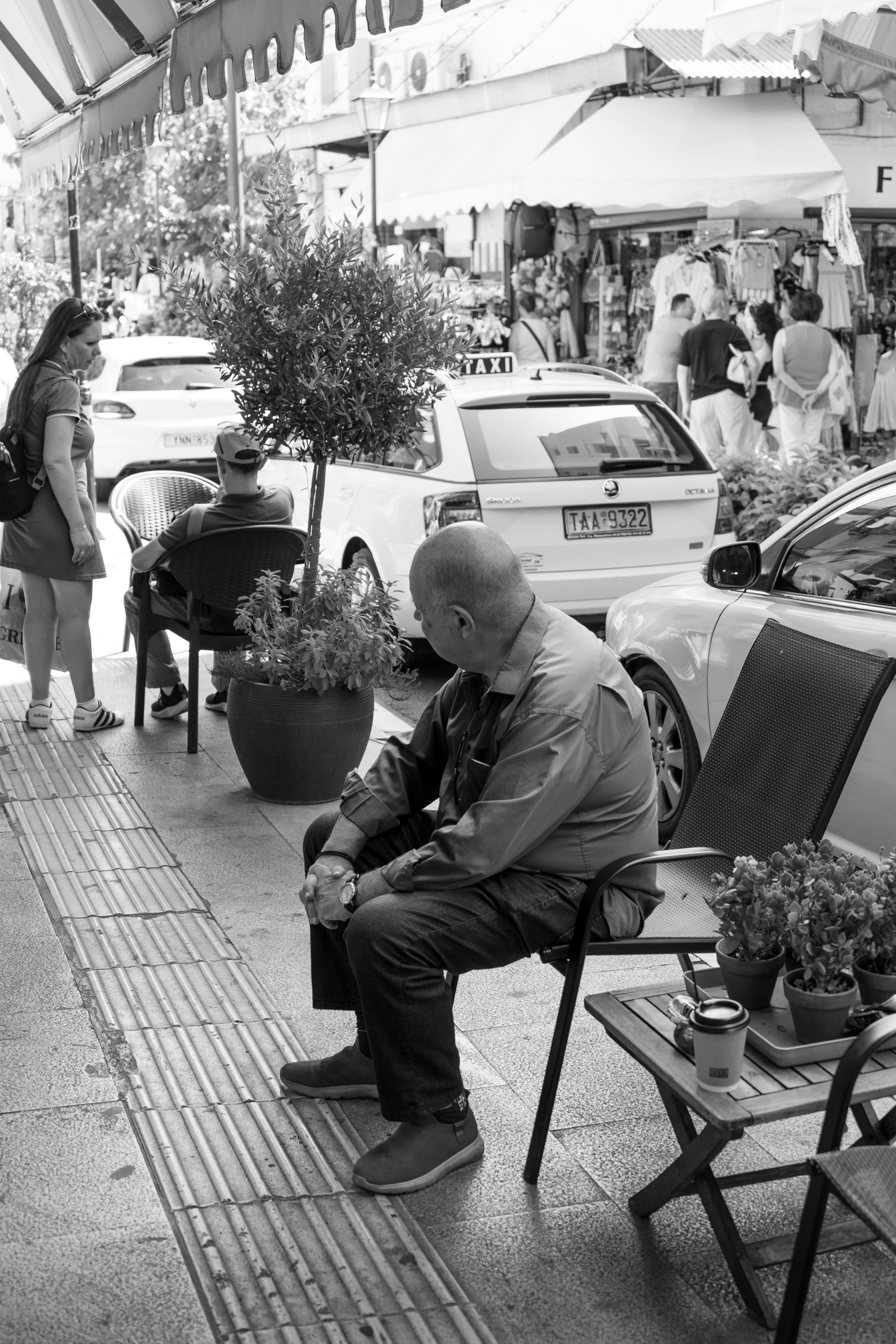 Quiet Reflection in a Bustling Street Café