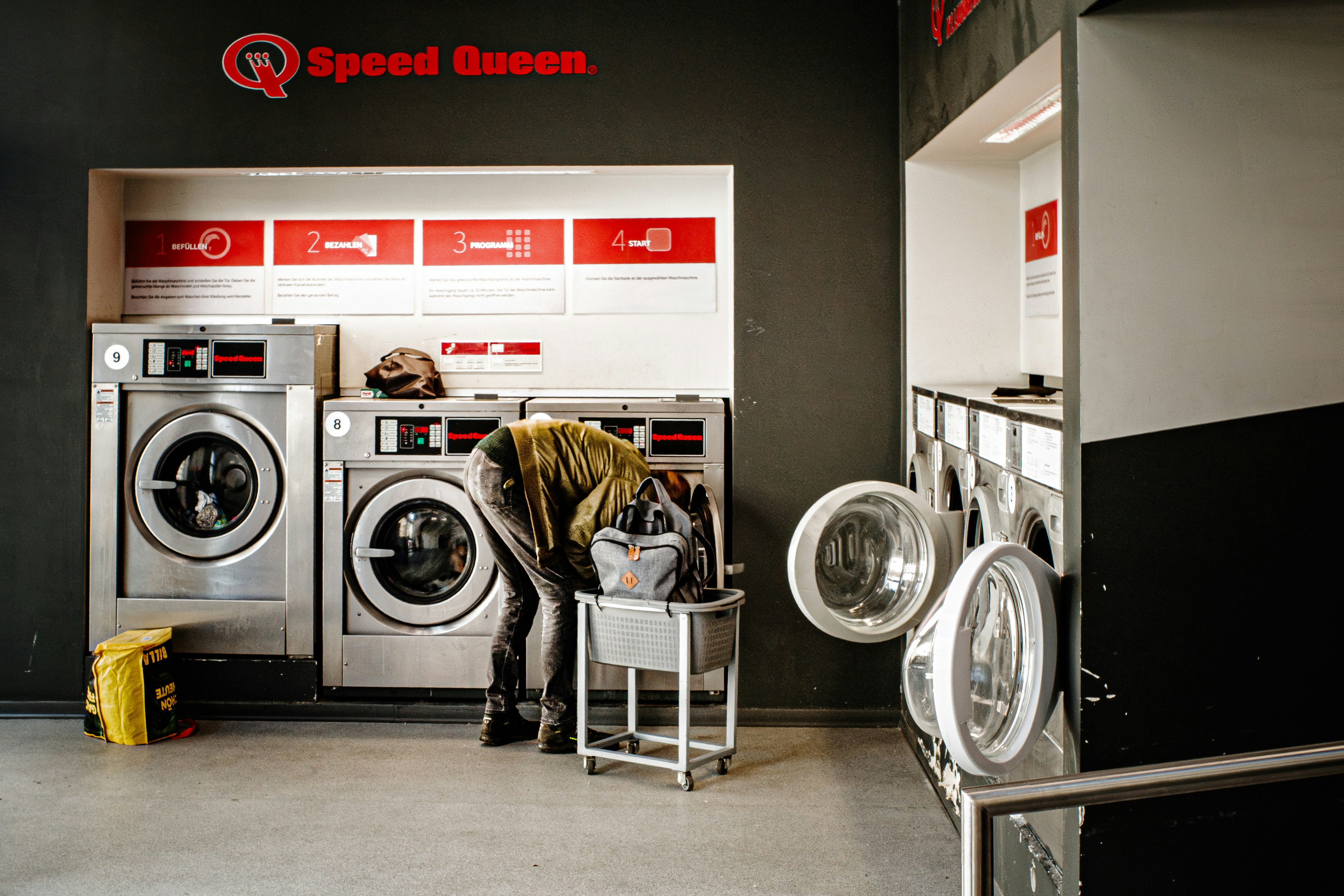 Laundry Day at Speed Queen: A Worker Tends the Machines
