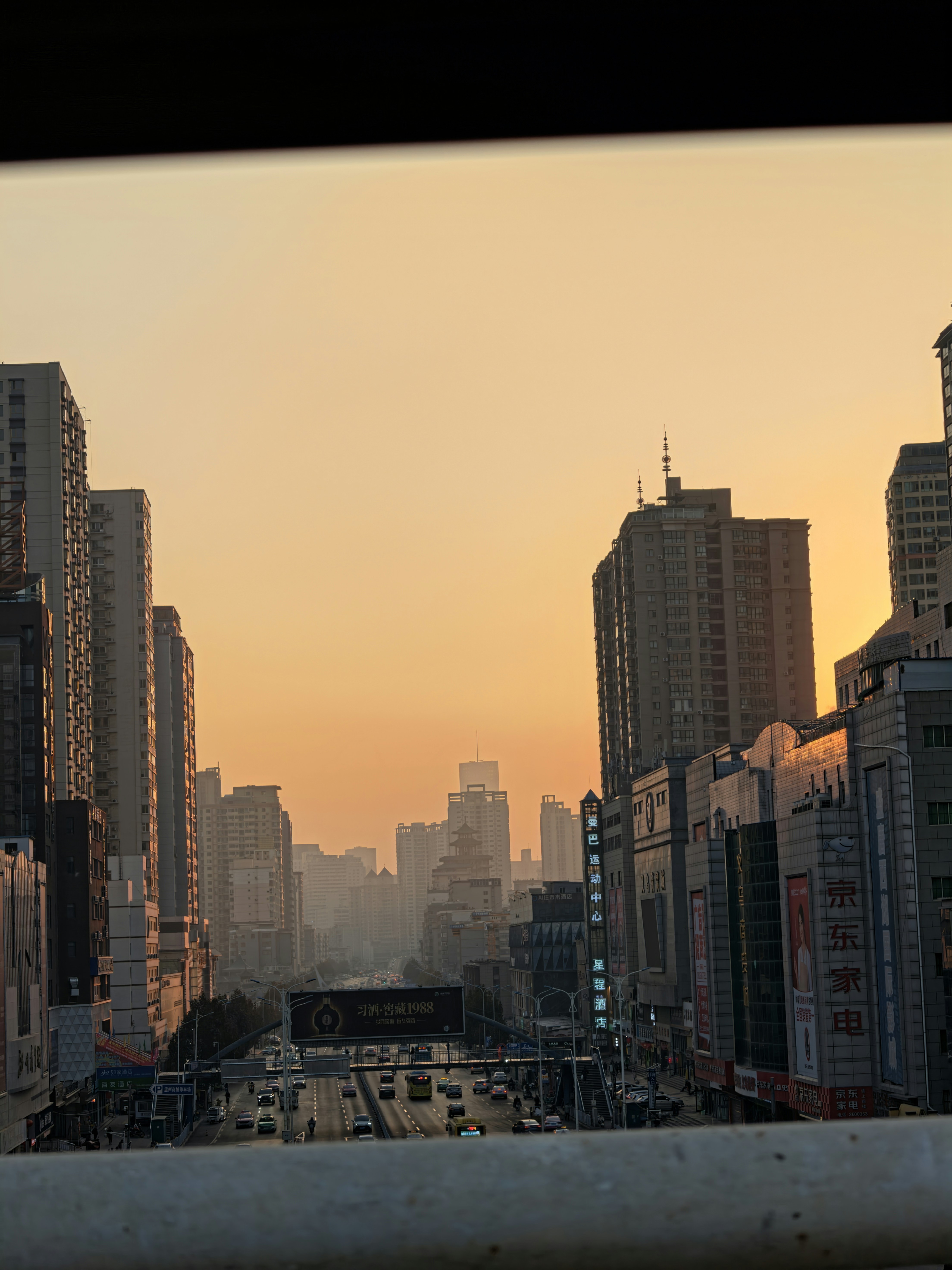 Cityscape with tall buildings at sunset