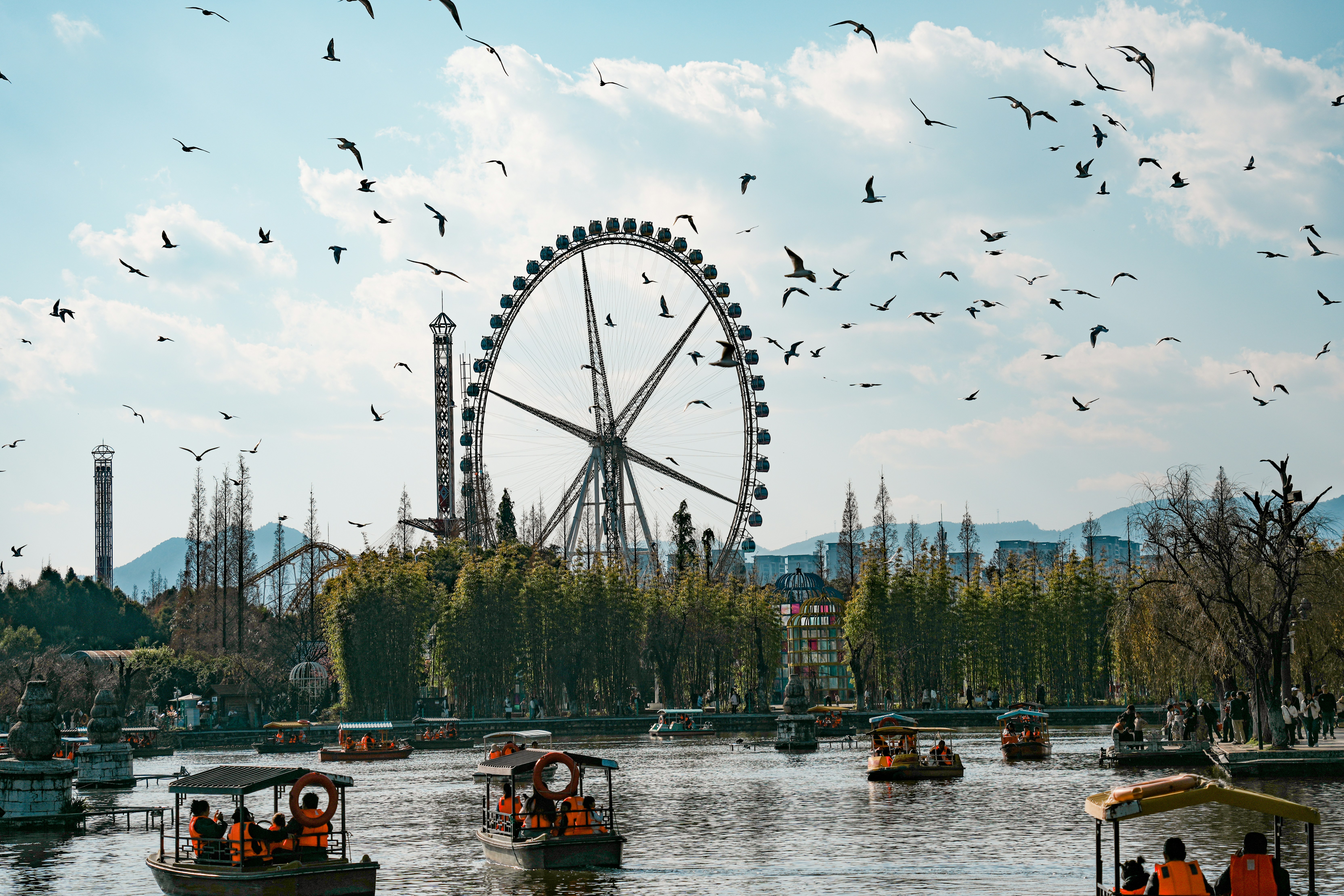 Rider Boats and the Silent Giant: A Ferris Wheel Over the River
