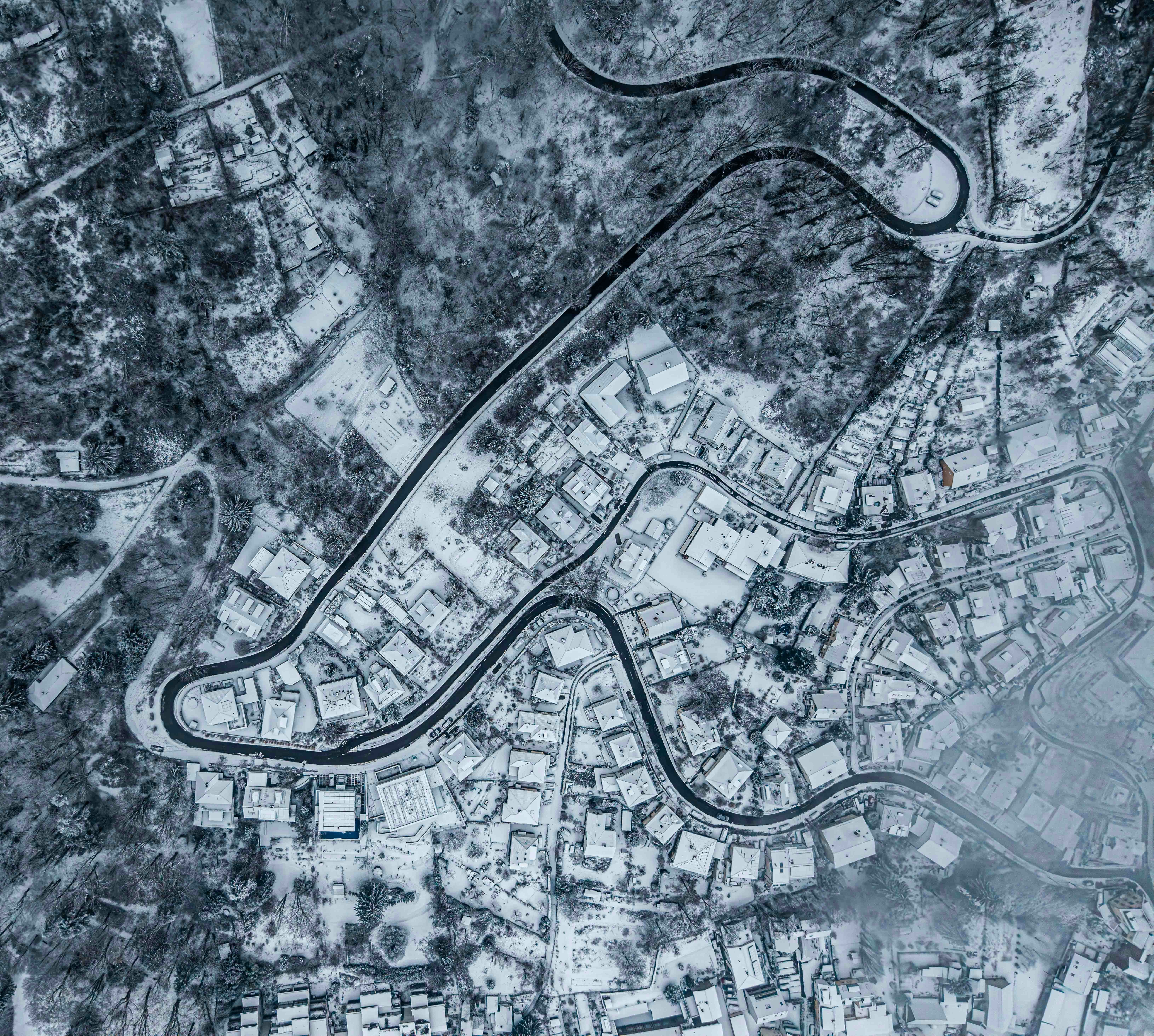 Snowbound Helix: Aerial Loop of a Quiet Suburban Crest