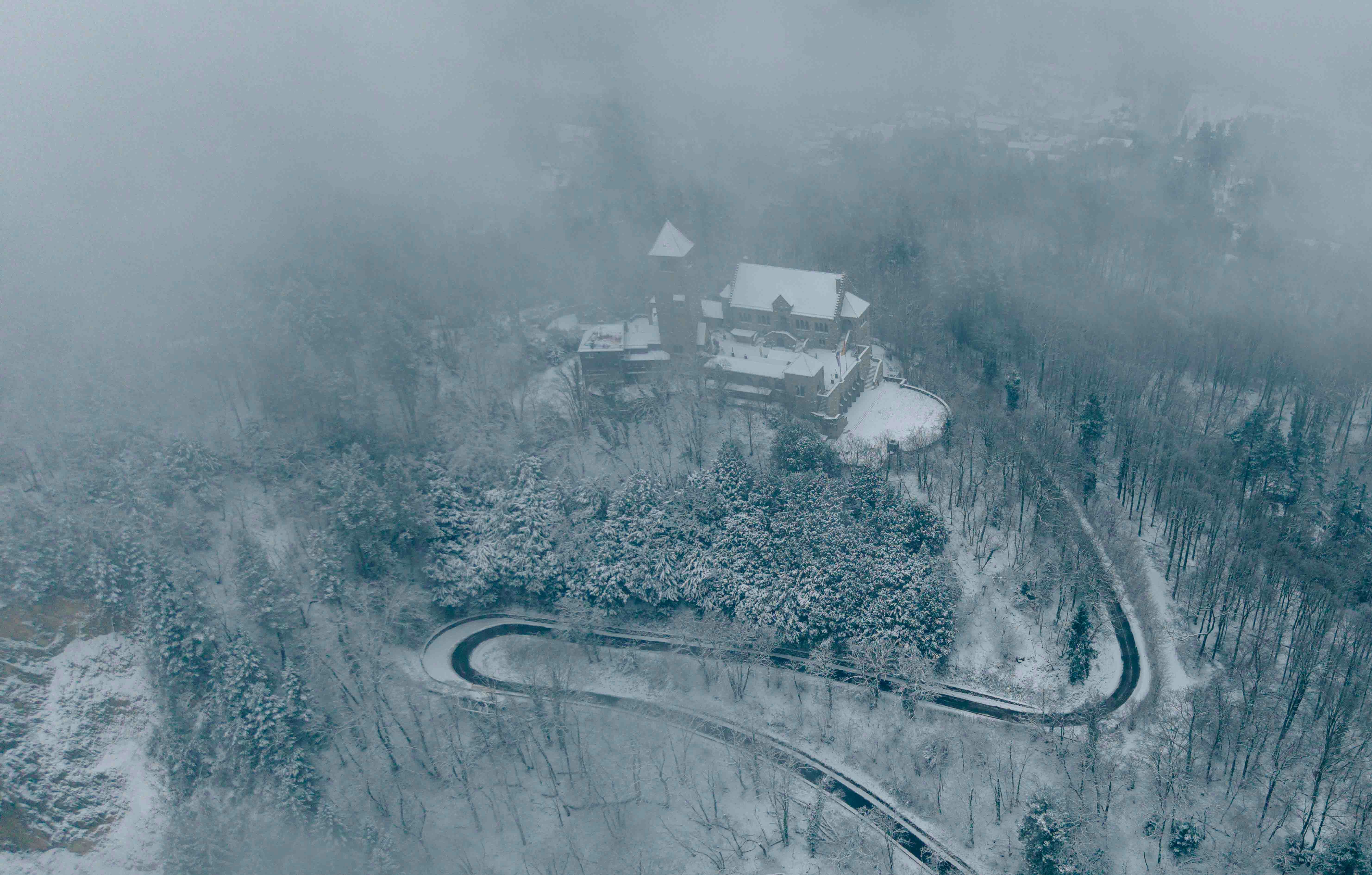Snowbound Switchback: Aerial Dance Above the Winding Road