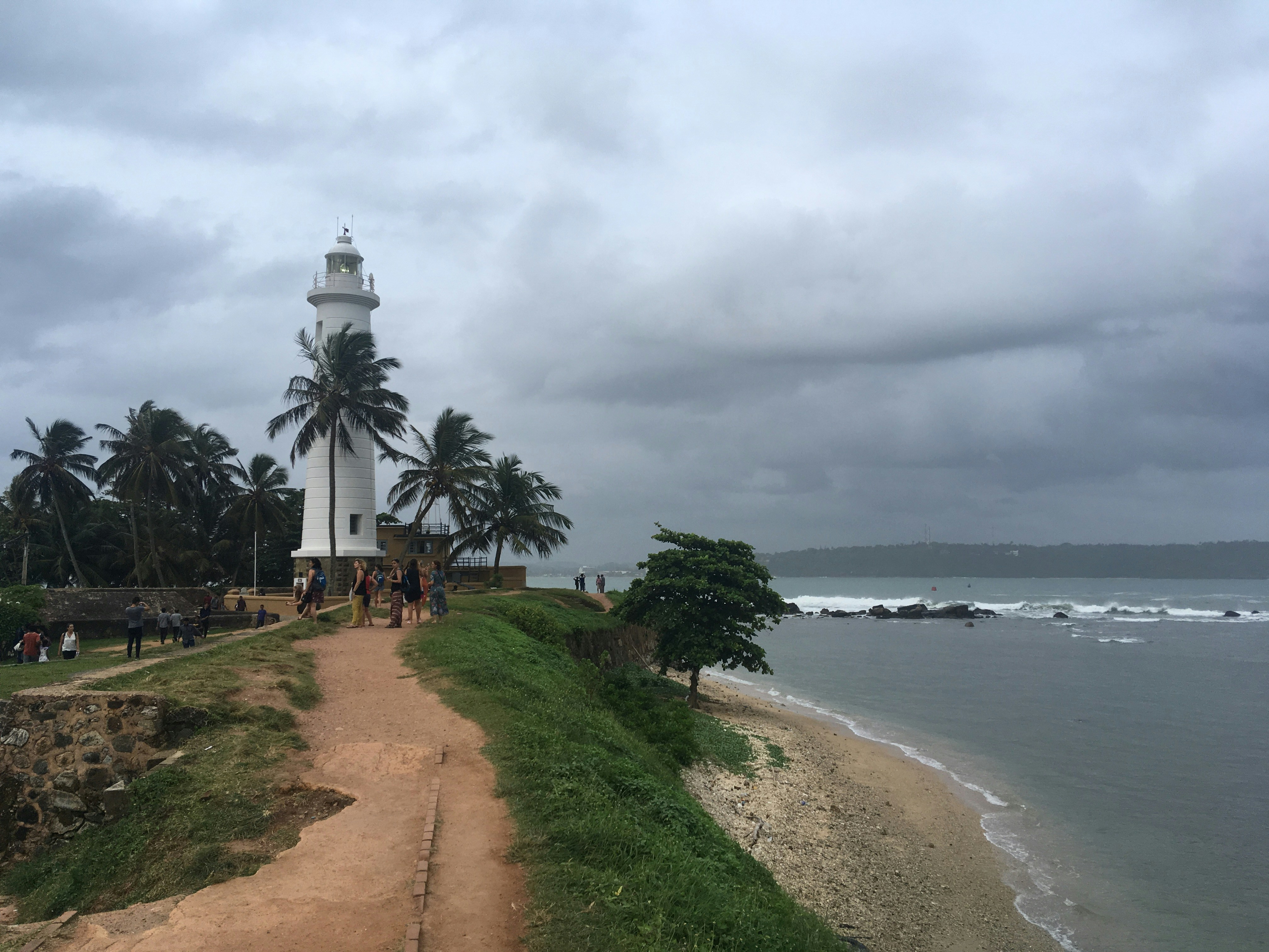 Lighthouse Trail: A Coastal Walk Beneath Stormy Skies