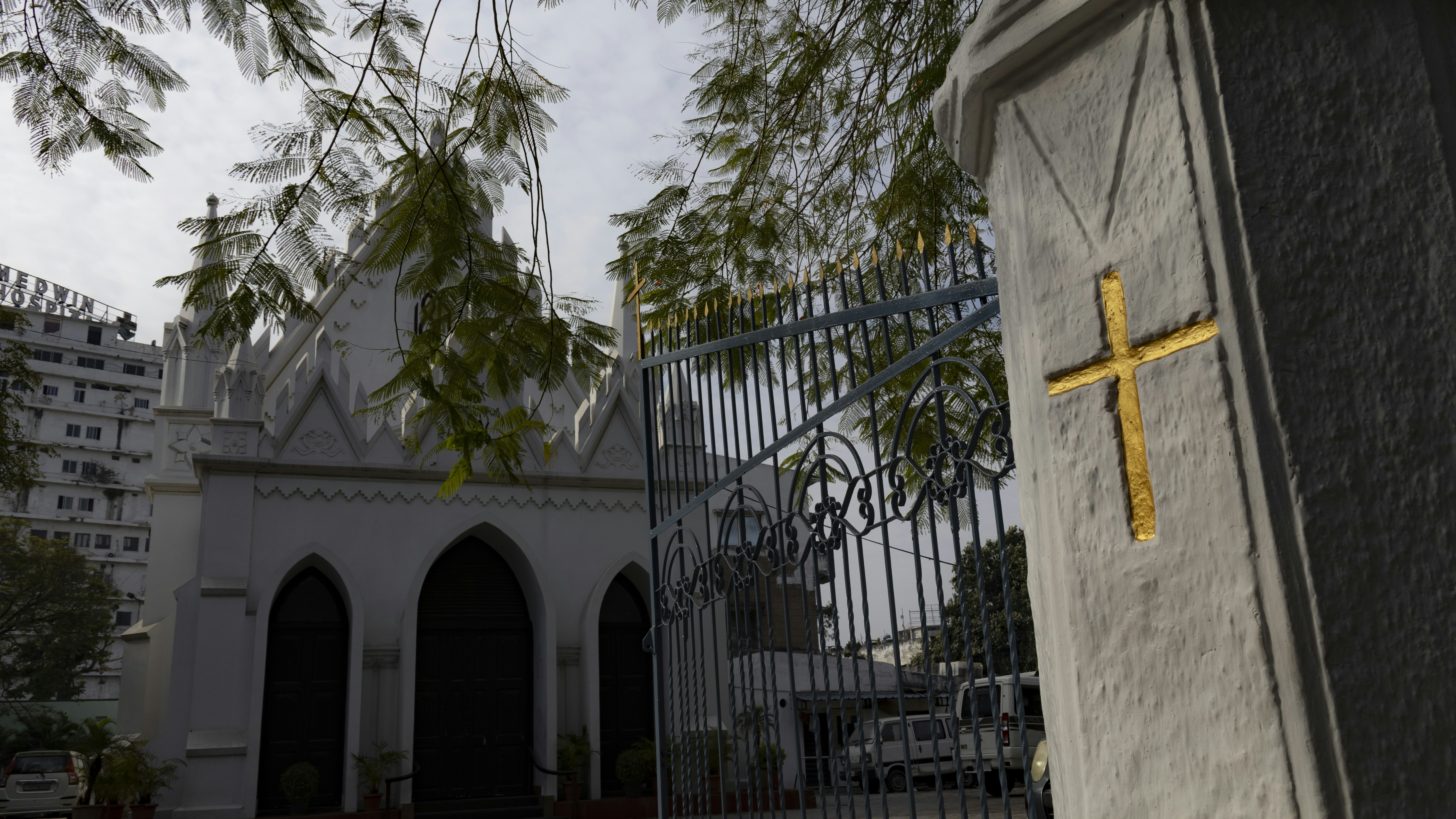 Gated Sanctum: Light, Shadow, and a Sacred Gate