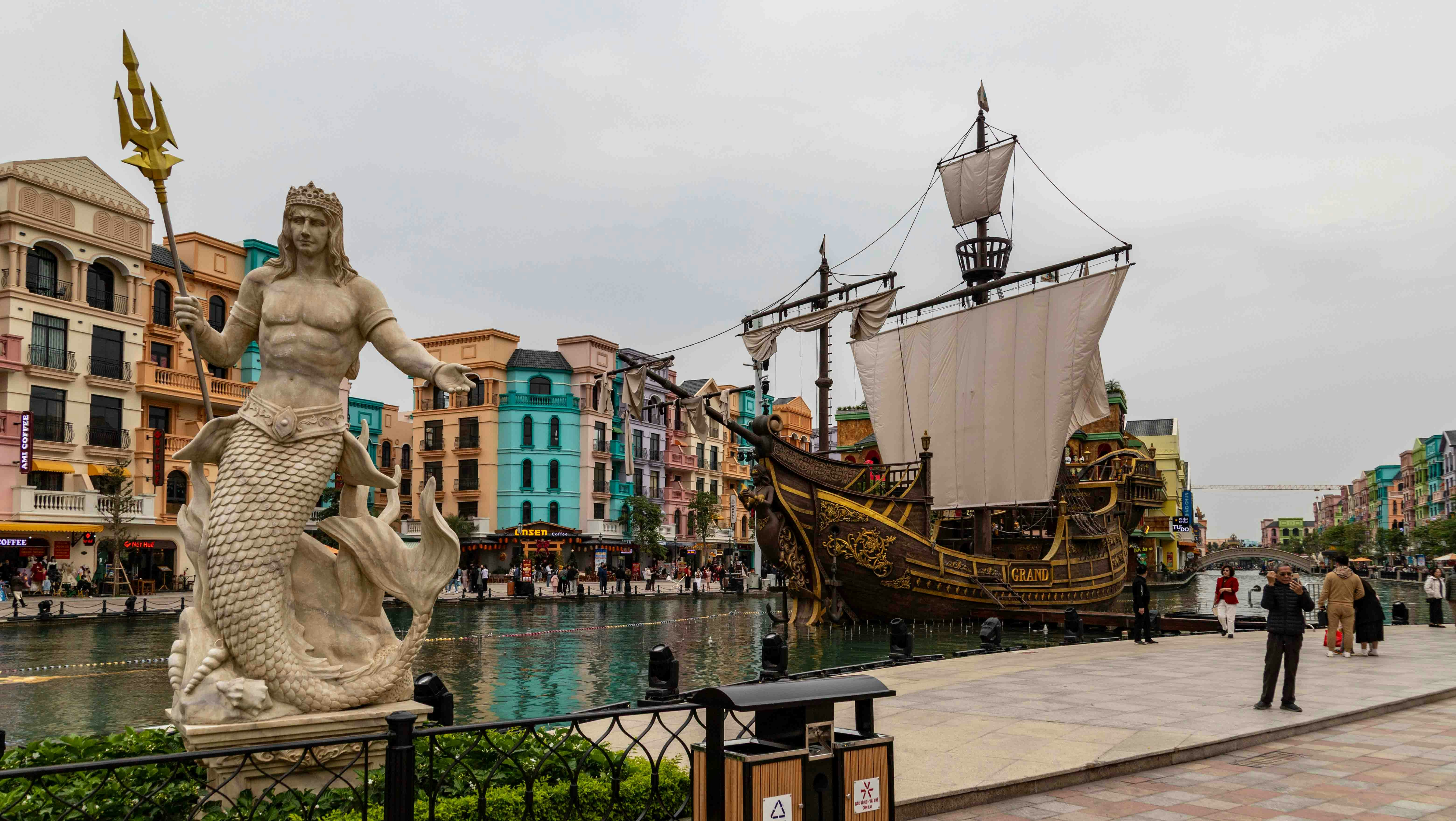  Maritime Theater: A Classical Ship Docked by a Colorful Seaside Row