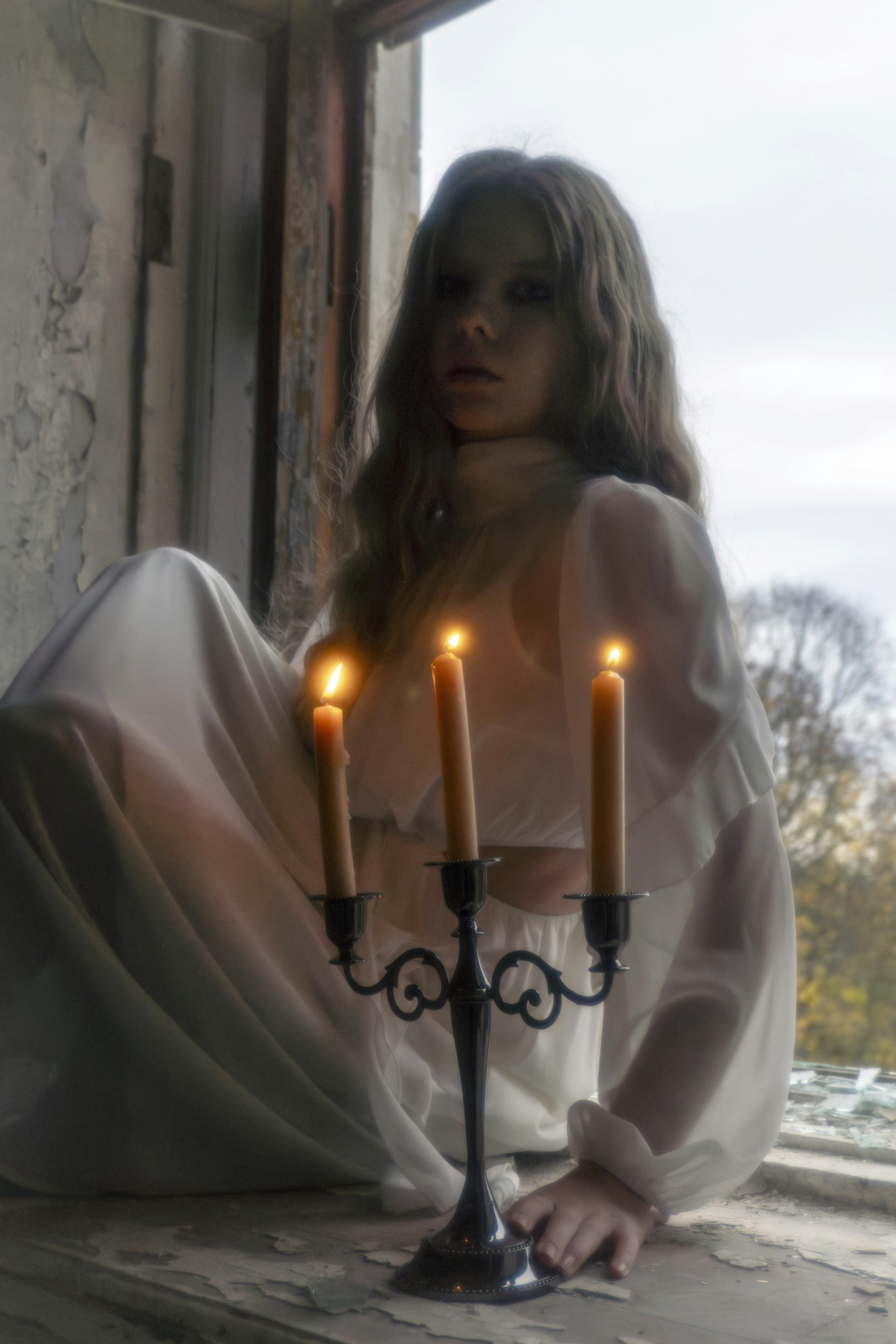 Candlelit Quiet: A Portrait by the Open Window