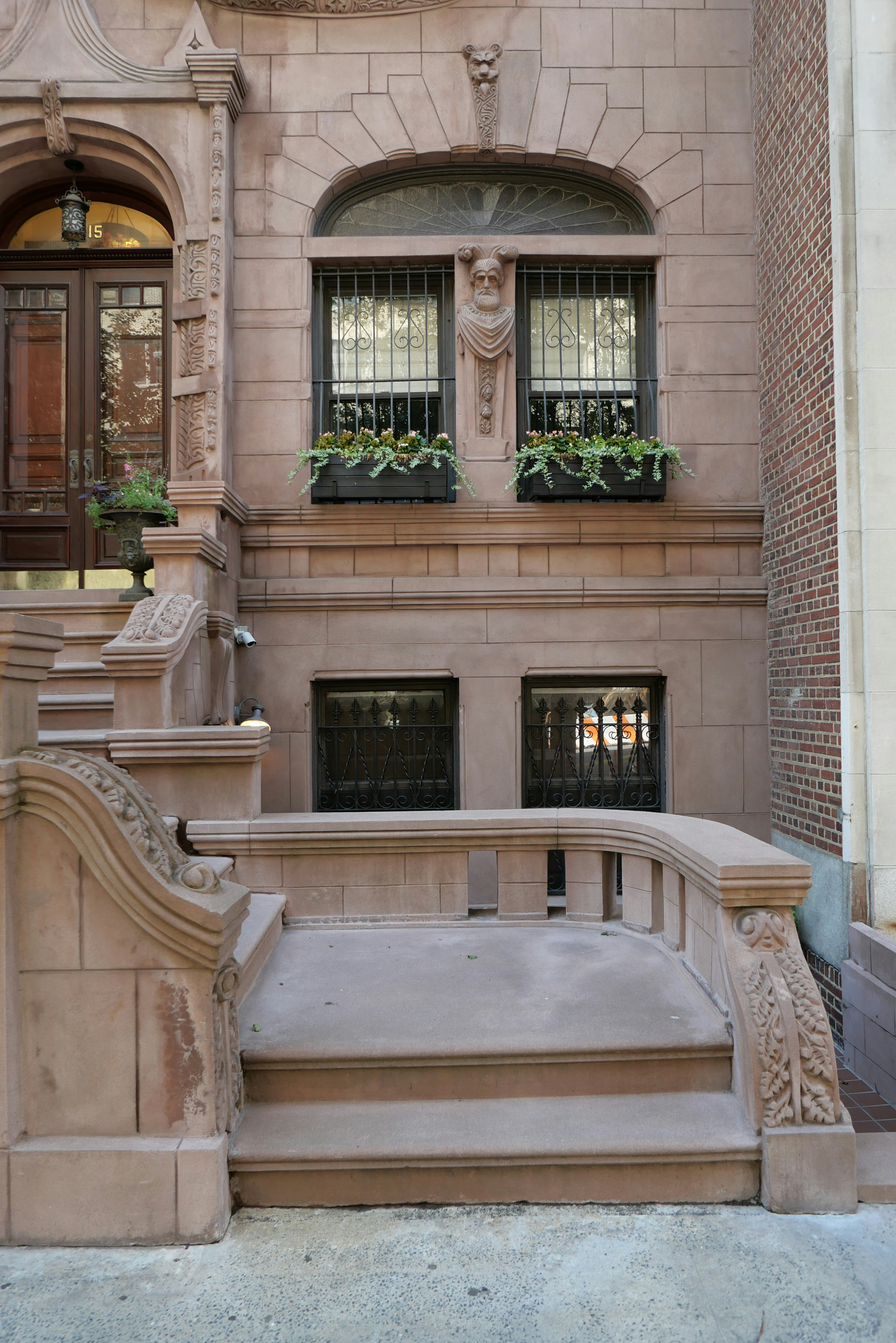 Brownstone Staircase: Classical Facade and Wrought Iron Windows