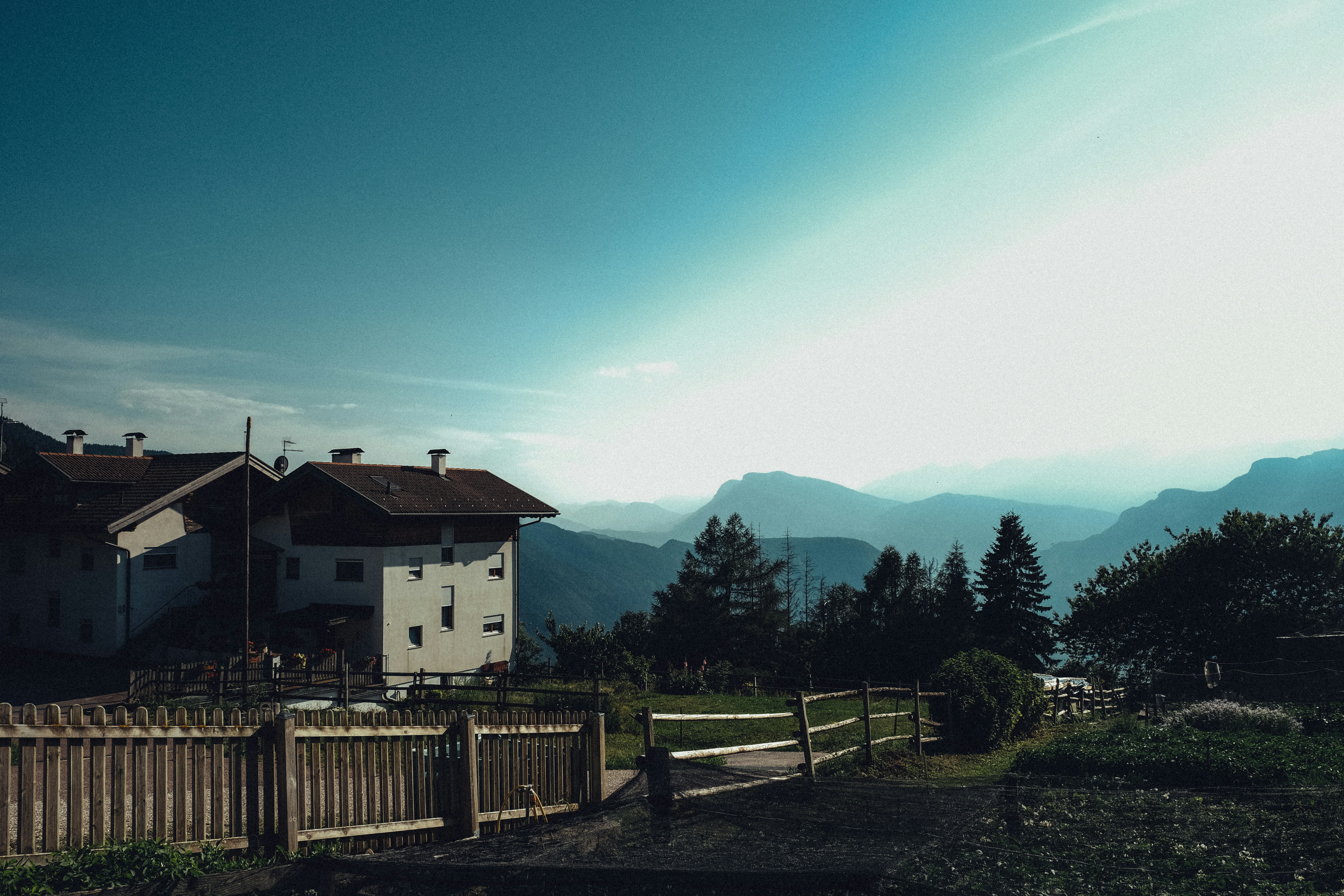 Sunlit Alpine Homestead Breathing Room Under a Clear Sky