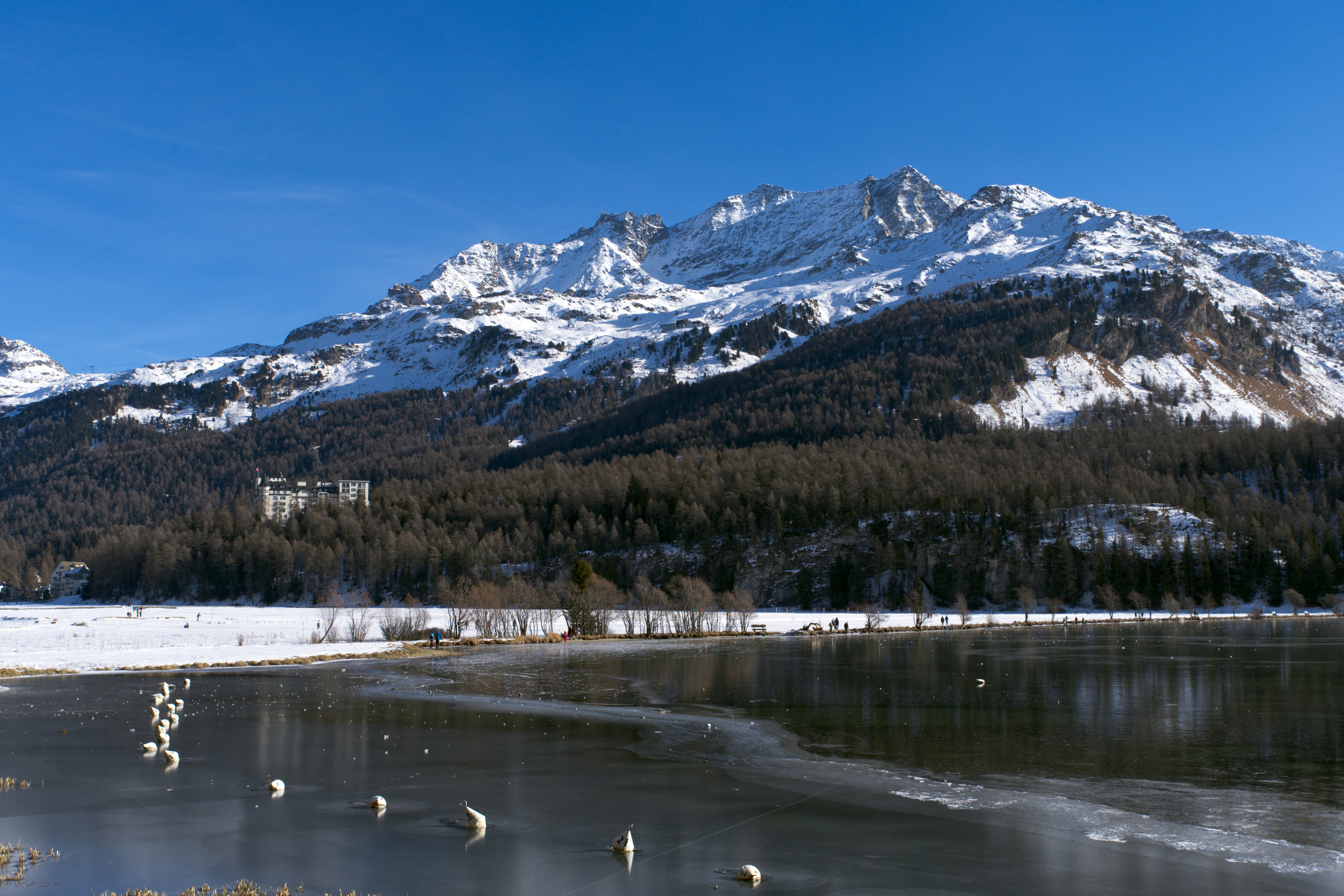 Snow-Capped Peaks Over a Frozen Lake