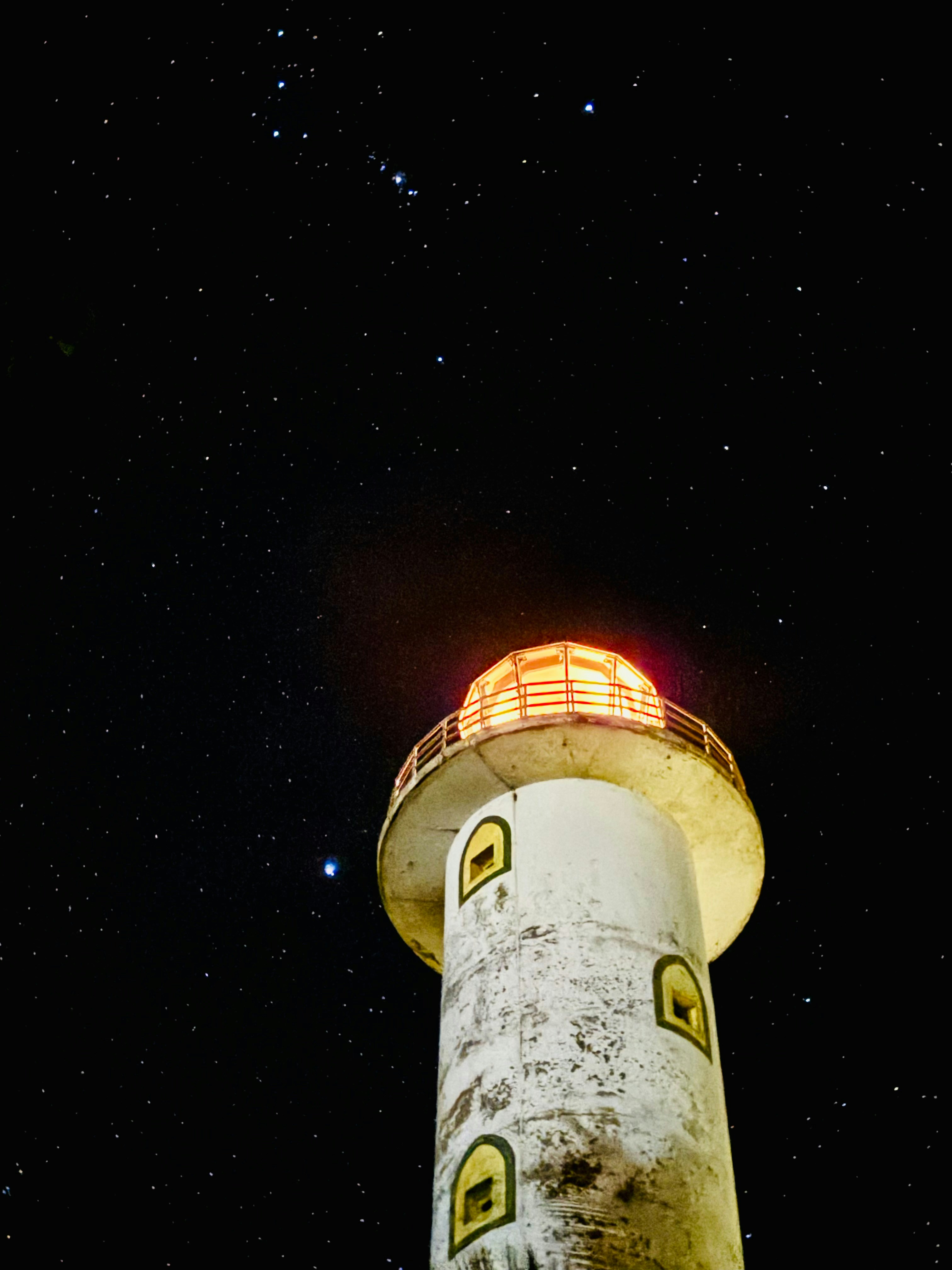 Lighthouse Under a Starry Veil