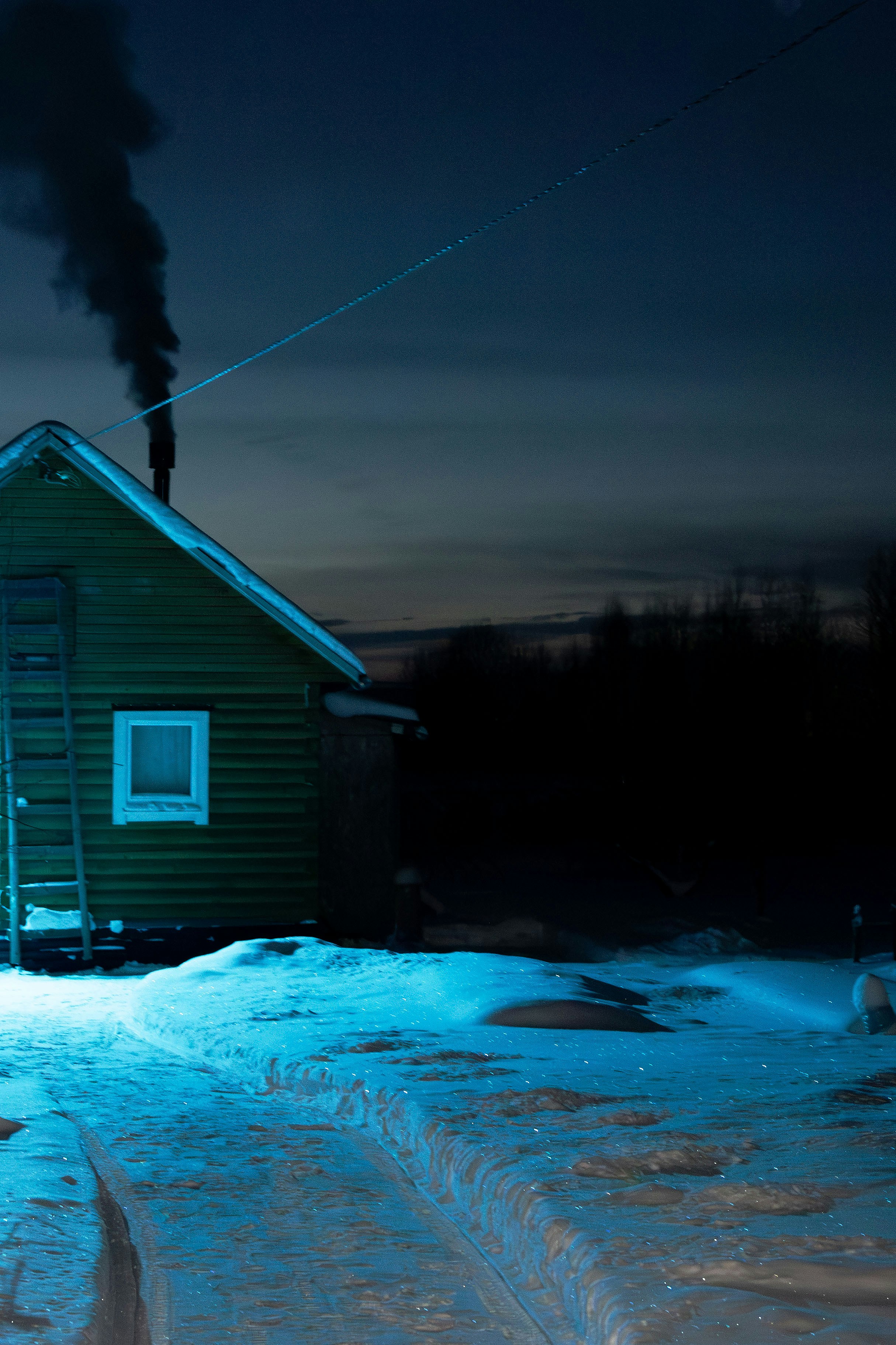 Blue Hour Smoke and Snow: A Quiet Winter Frontier