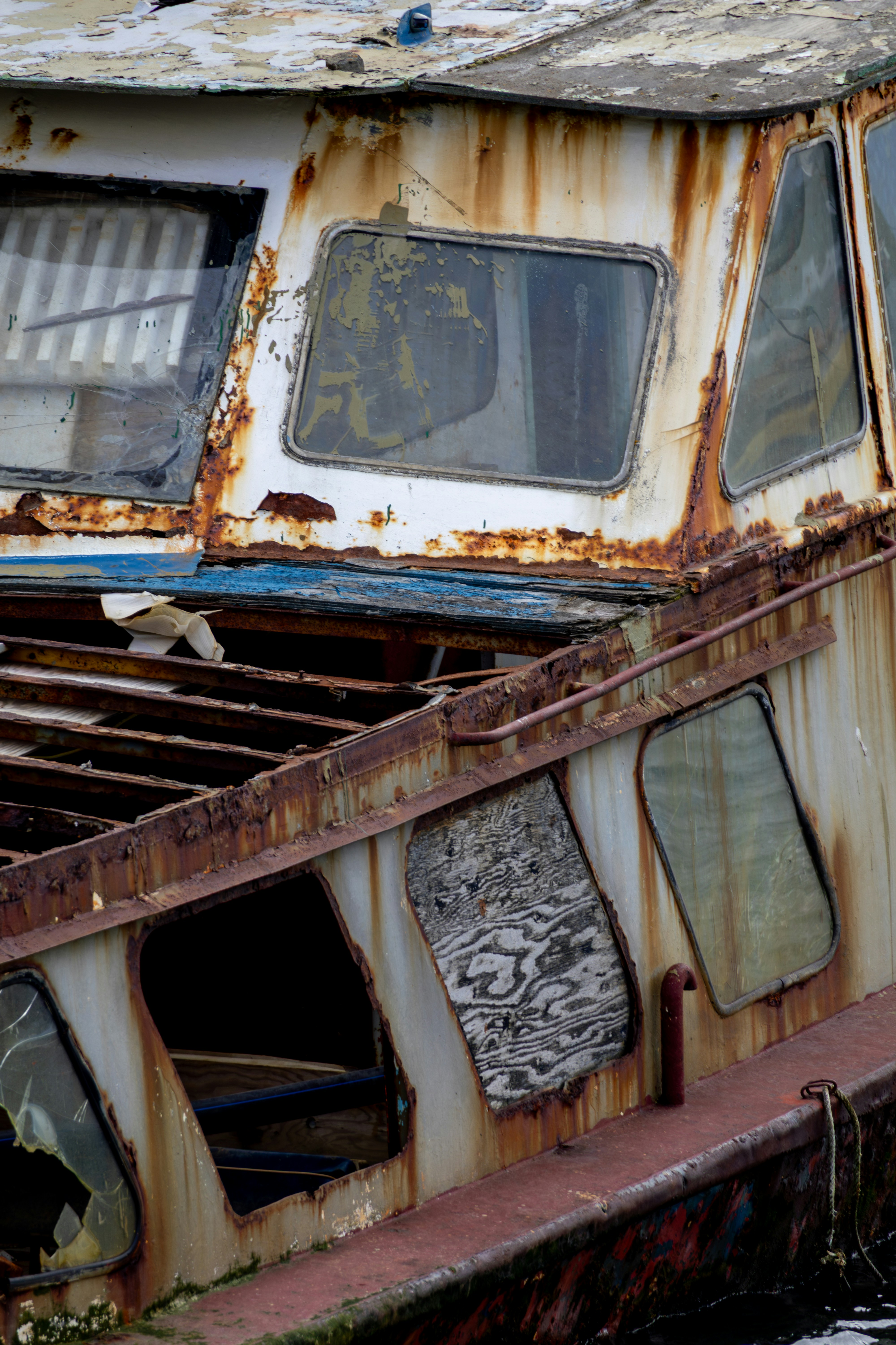 Close-up of a rusty, derelict boat with broken windows. photo – Free ...