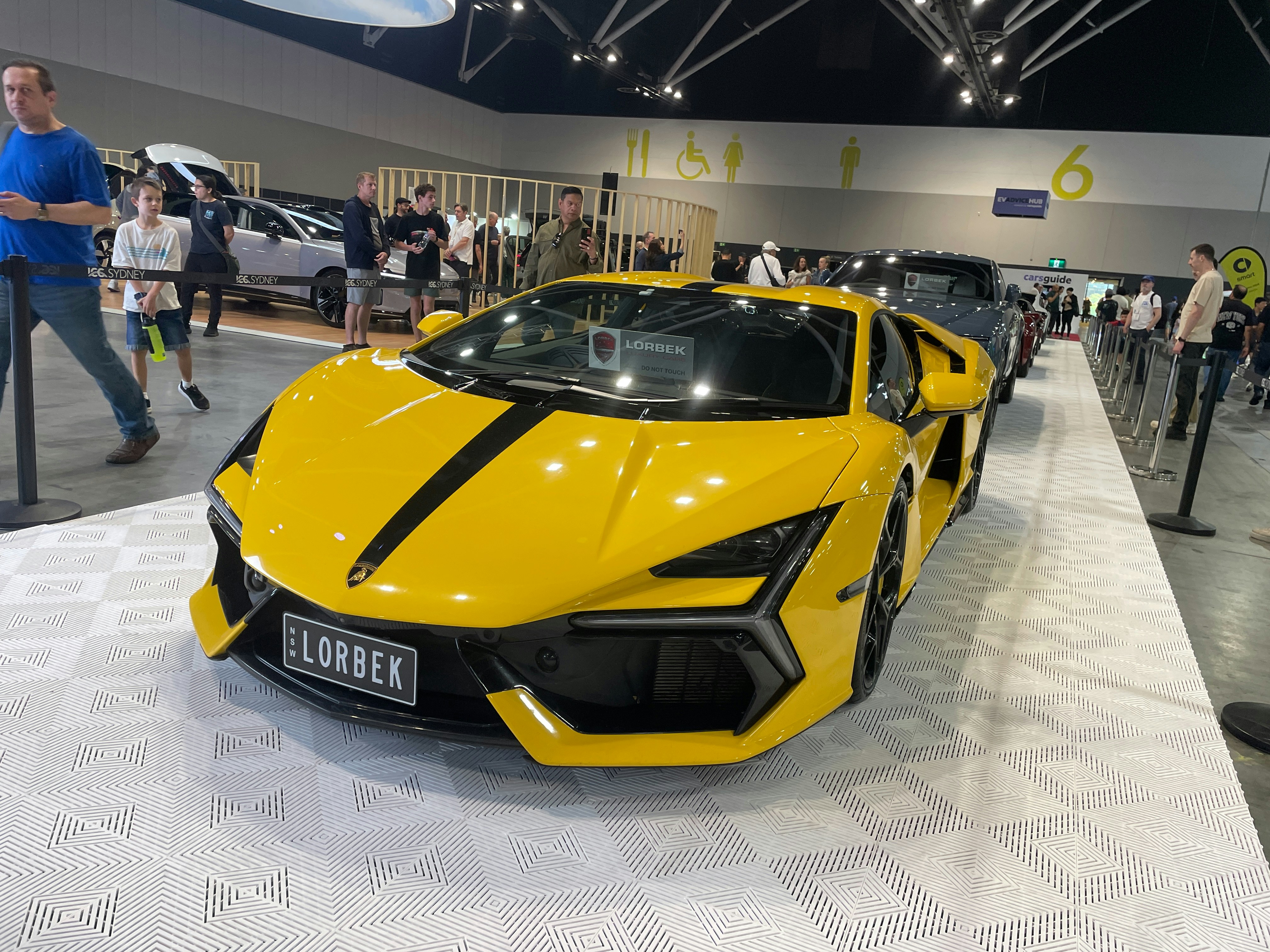 Yellow thunder on display: a sharp Lamborghini prowls the showroom
