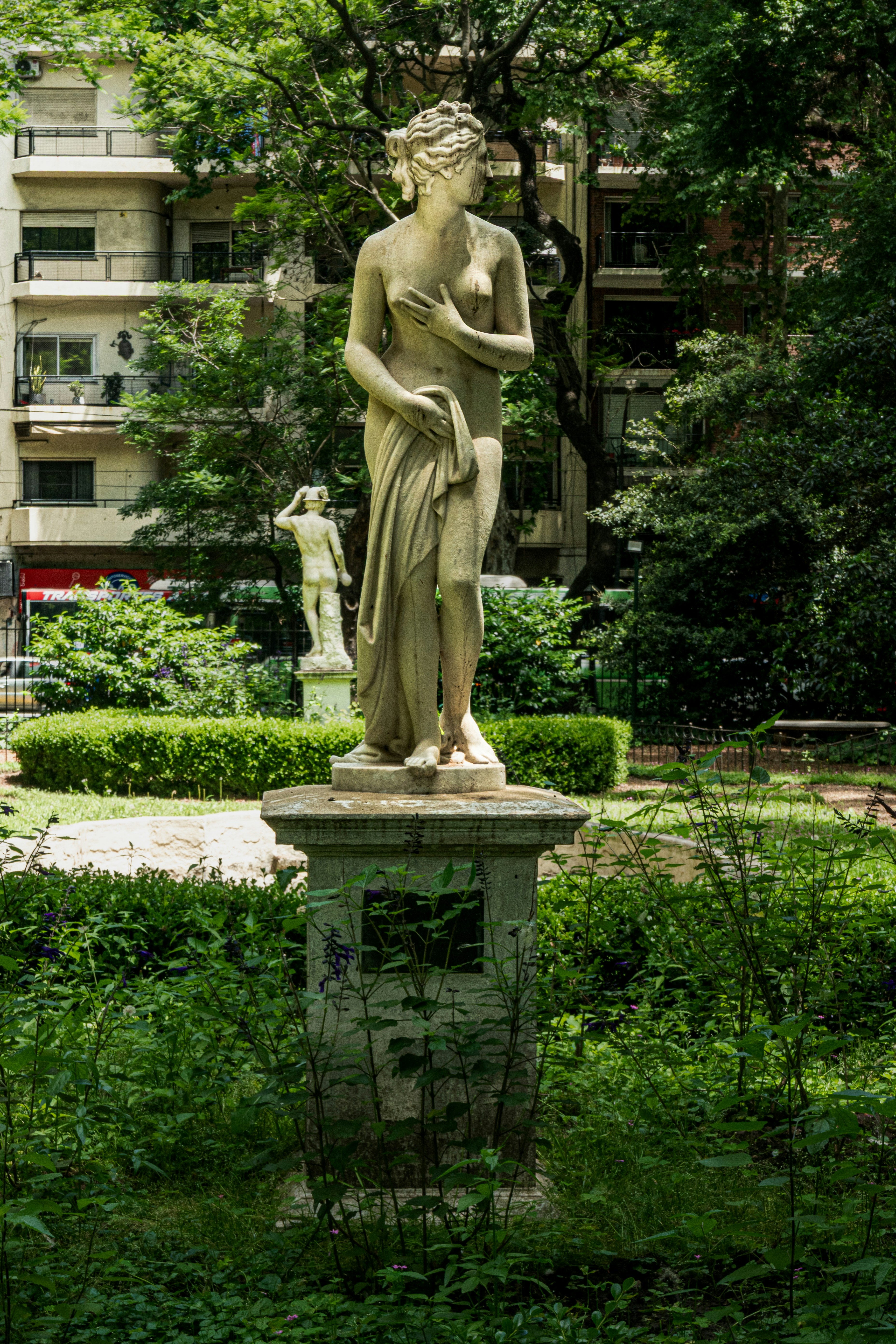 Sculpted Grace in a City Garden