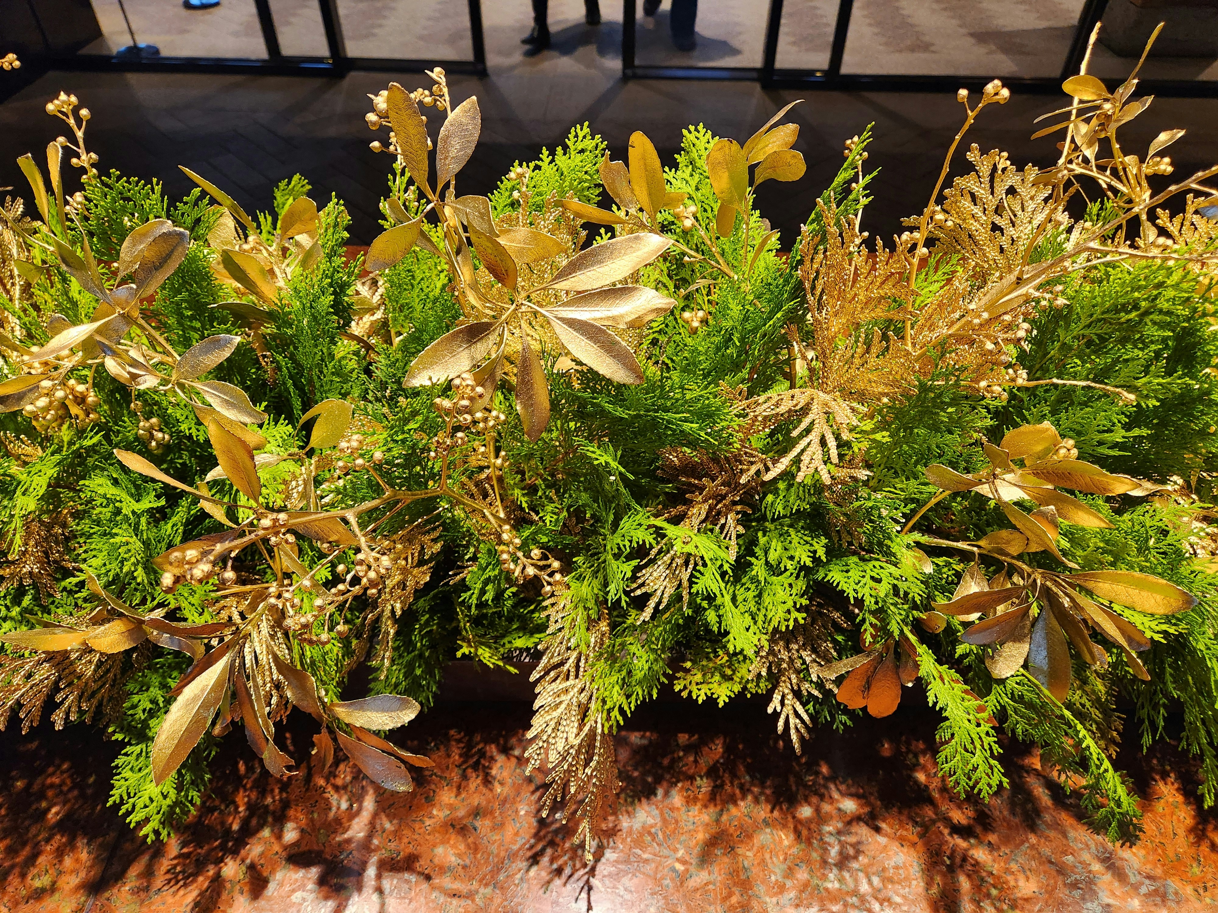 Autumn-greenery on a rusted ledge