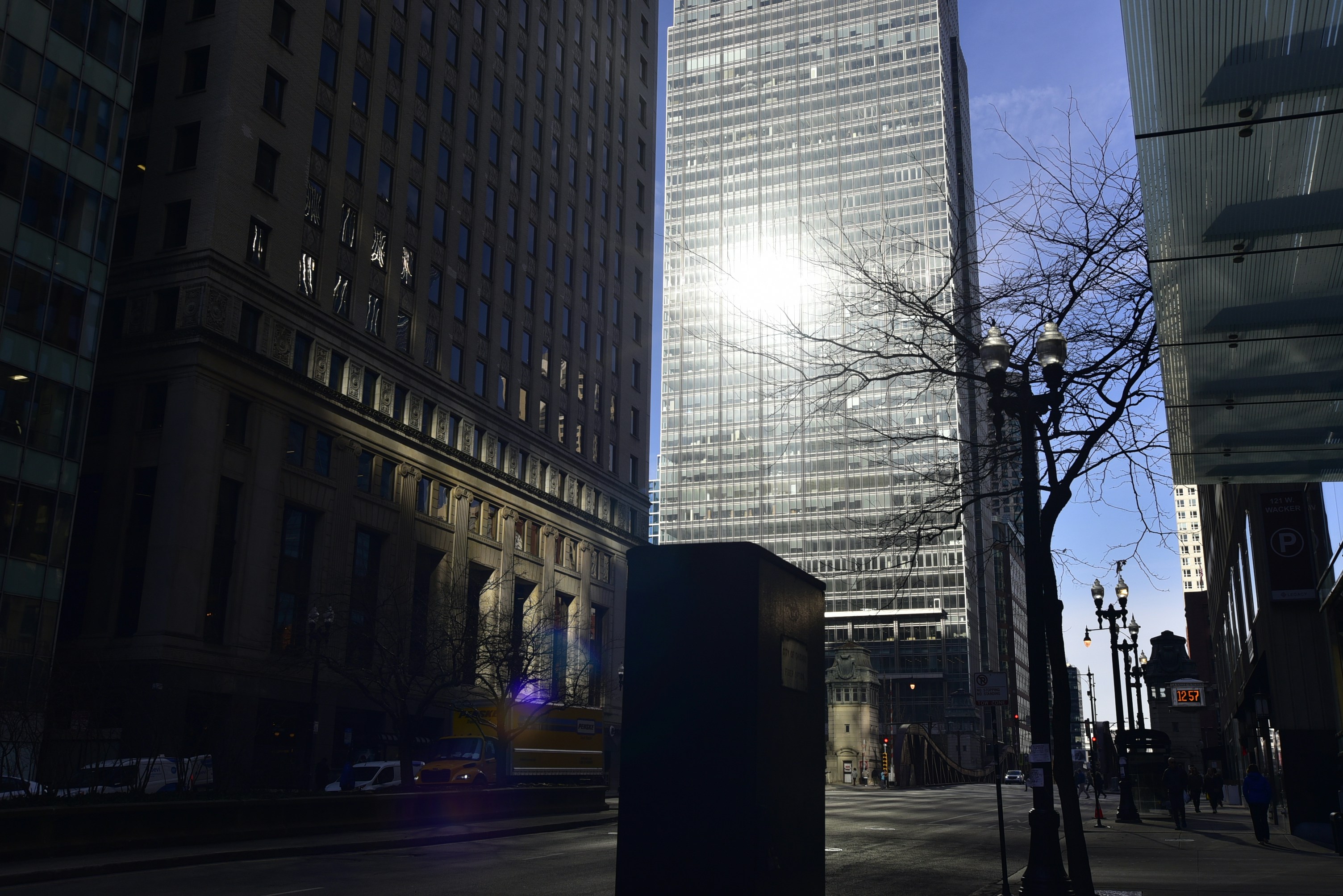 Urban Spotlight: Sunburst Over a City Monolith
