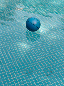 Blue Ball Adrift Above the Pool Grid