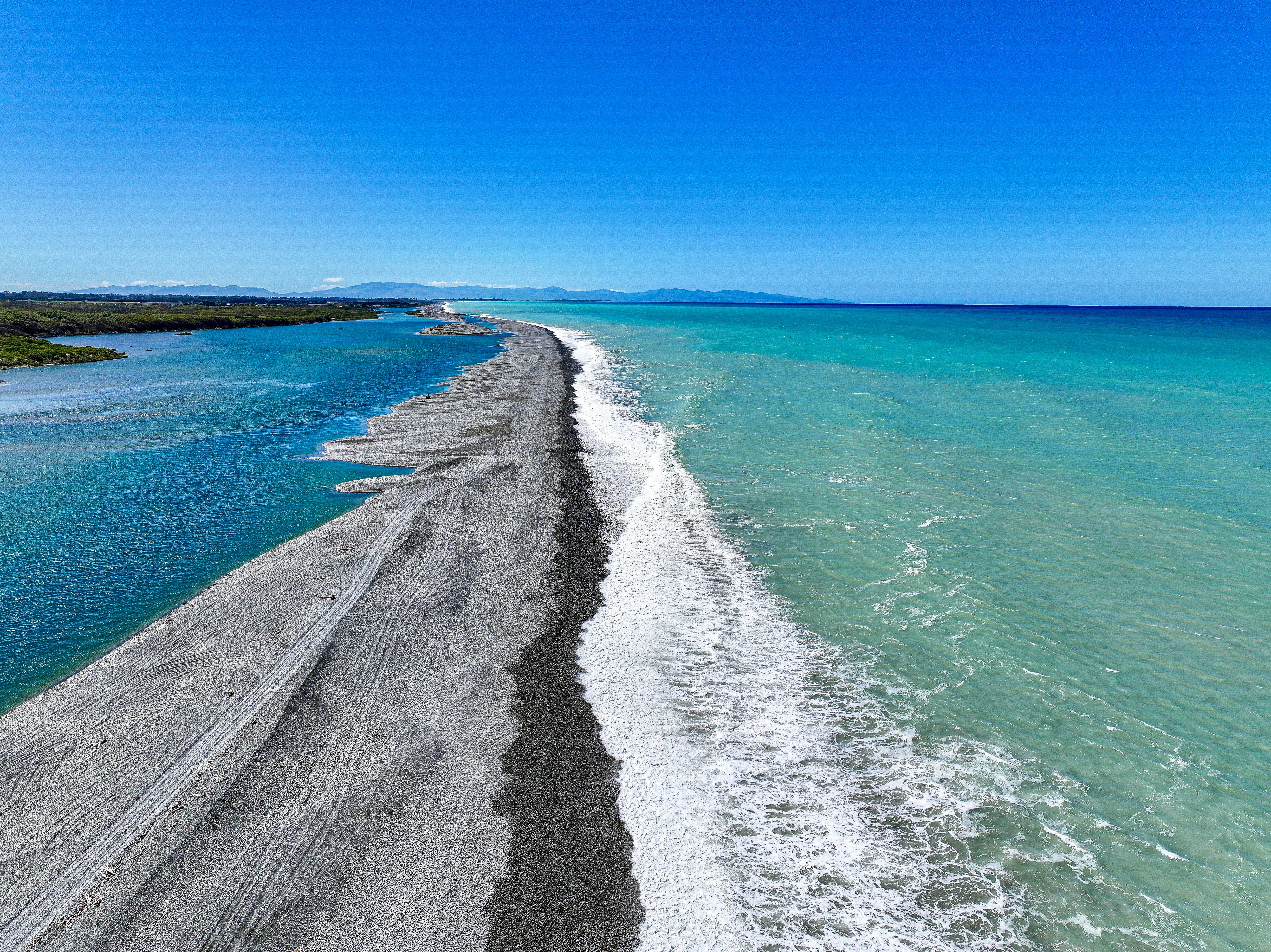 A Narrow Sand Spine Dividing Turquoise Seas