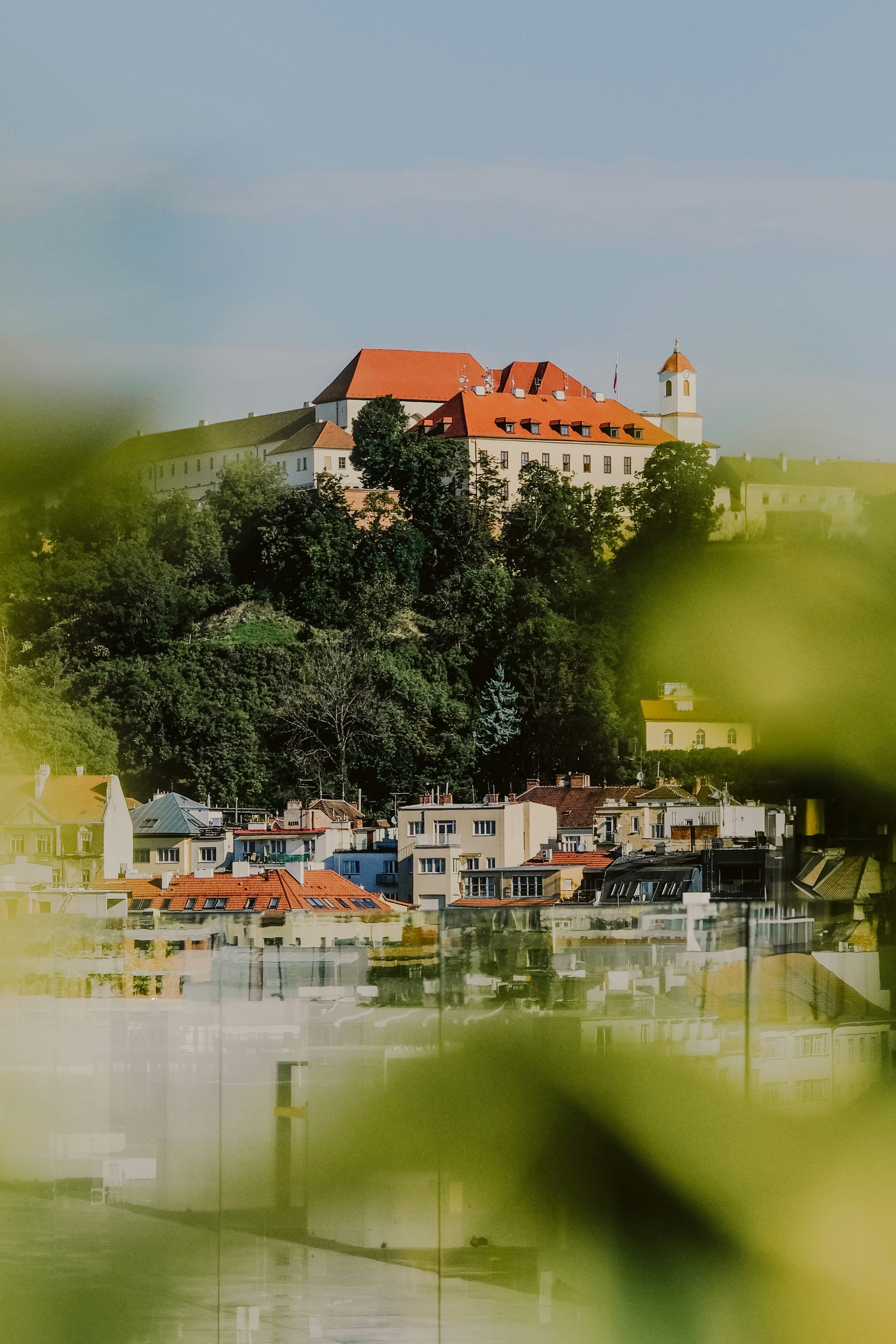 Castle on the Hilltop Framing a Town below, Softly Framed by Greenery