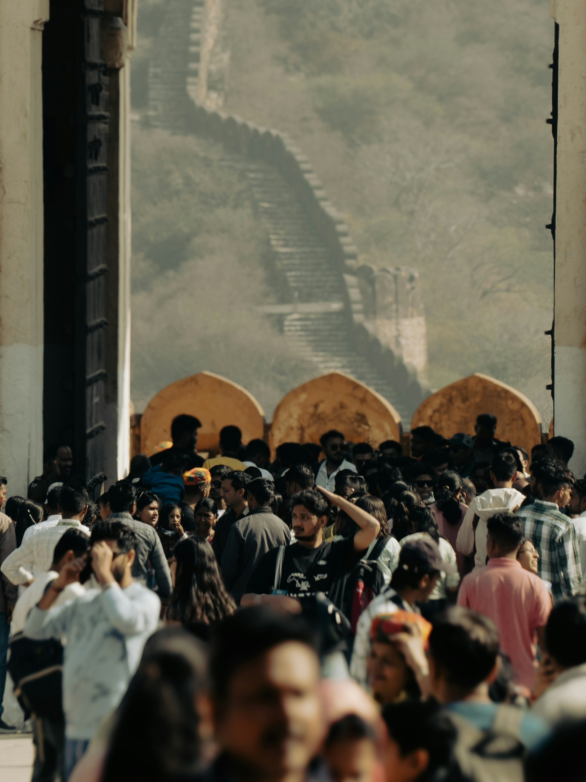 Crowd at the Footbridge: A Quiet Pause Beneath the Steps