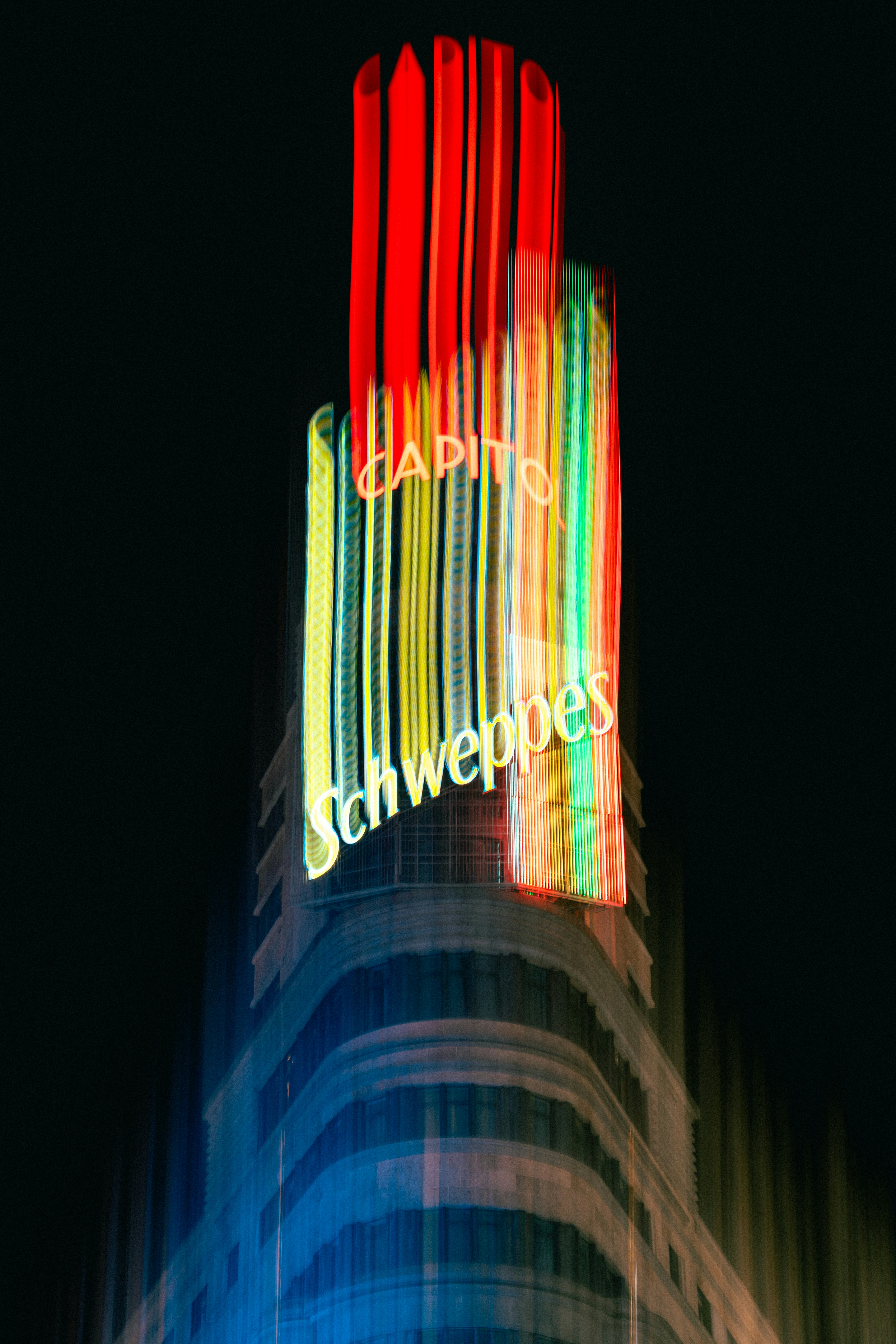 Neon Cape: Schweppes Sign in Long-Exposure Night Glow